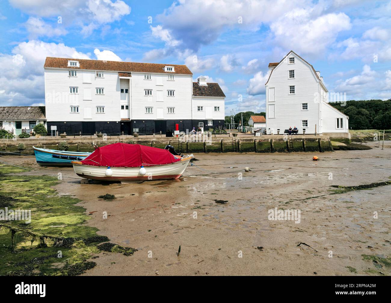 The famous tide mill at Woodbridge in Suffolk seen across the mud of ...