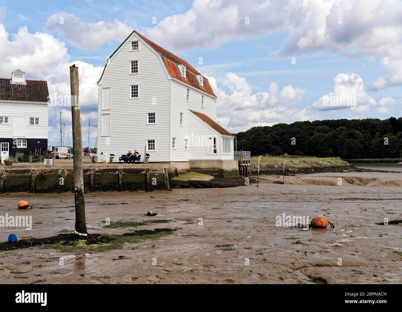 The famous tide mill at Woodbridge in Suffolk seen across the mud of ...
