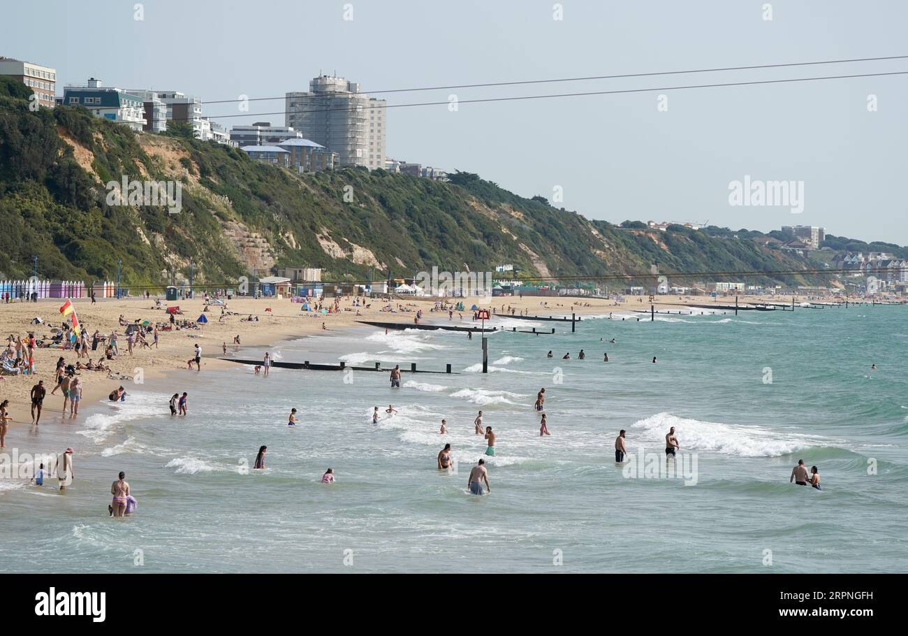 People enjoying the warm weather on Bournemouth beach in Dorset, as ...