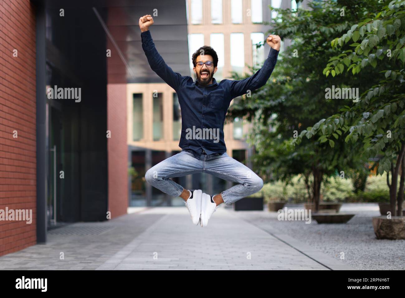 Thrilled young indian guy hi-res stock photography and images - Alamy