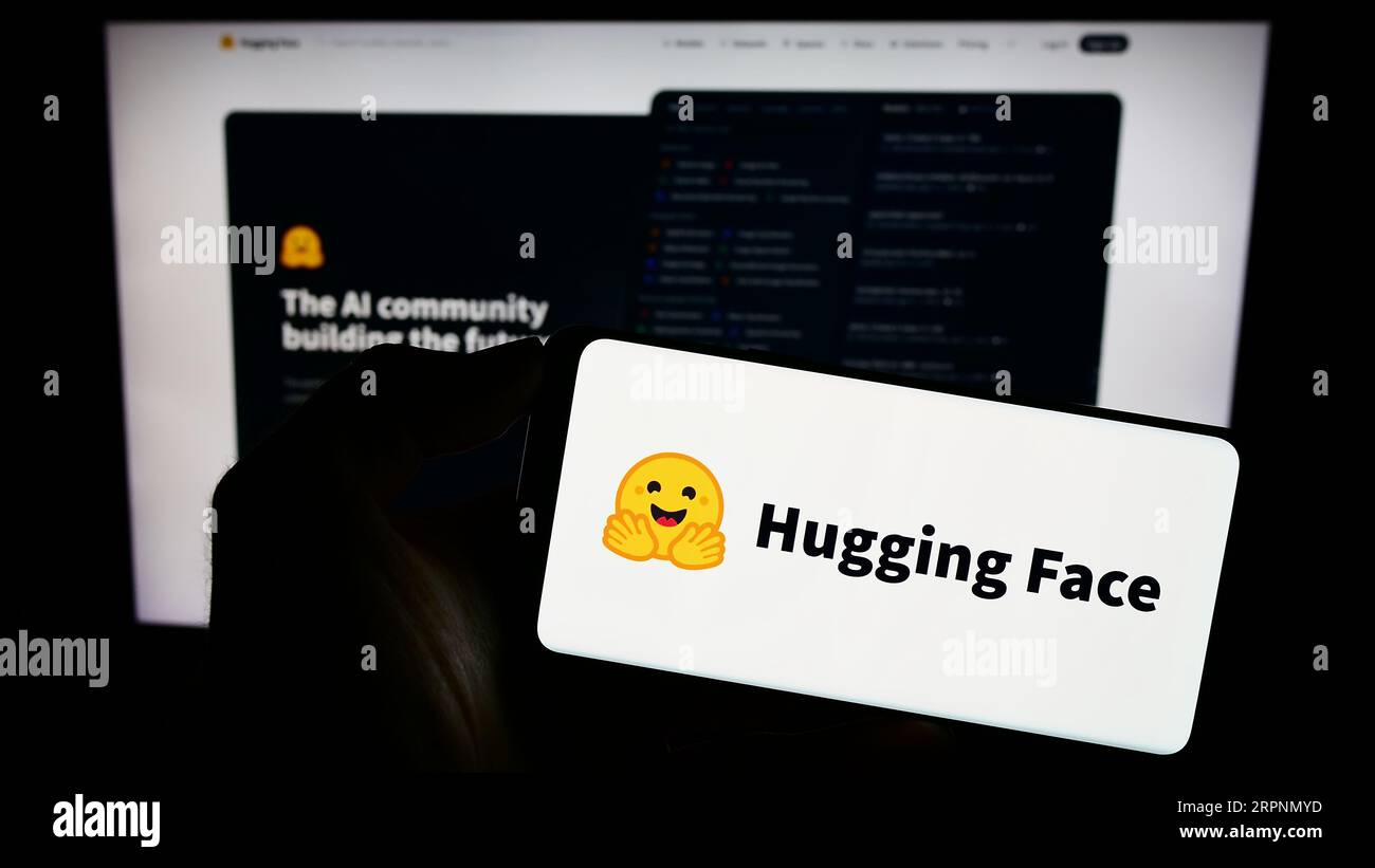 Person holding mobile phone with logo of artificial intelligence ...