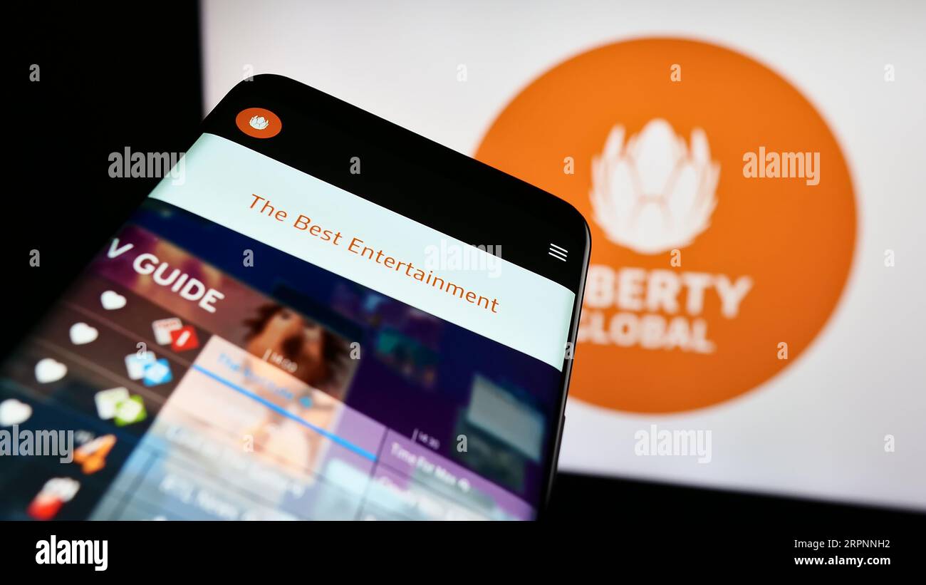 Smartphone with website of telecommunications company Liberty Global on ...