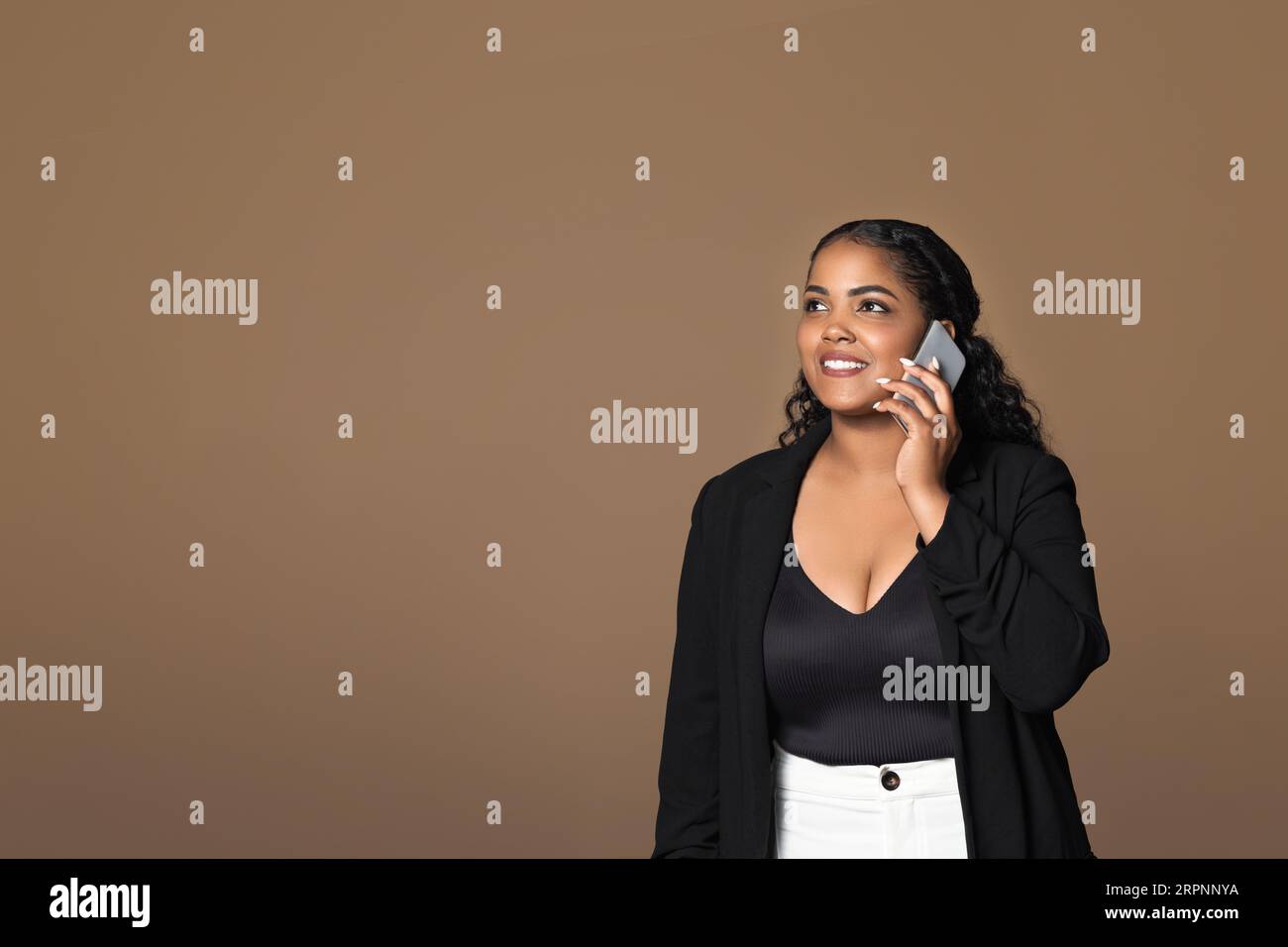 Beautiful brazilian businesswoman talking on mobile phone, making call ...