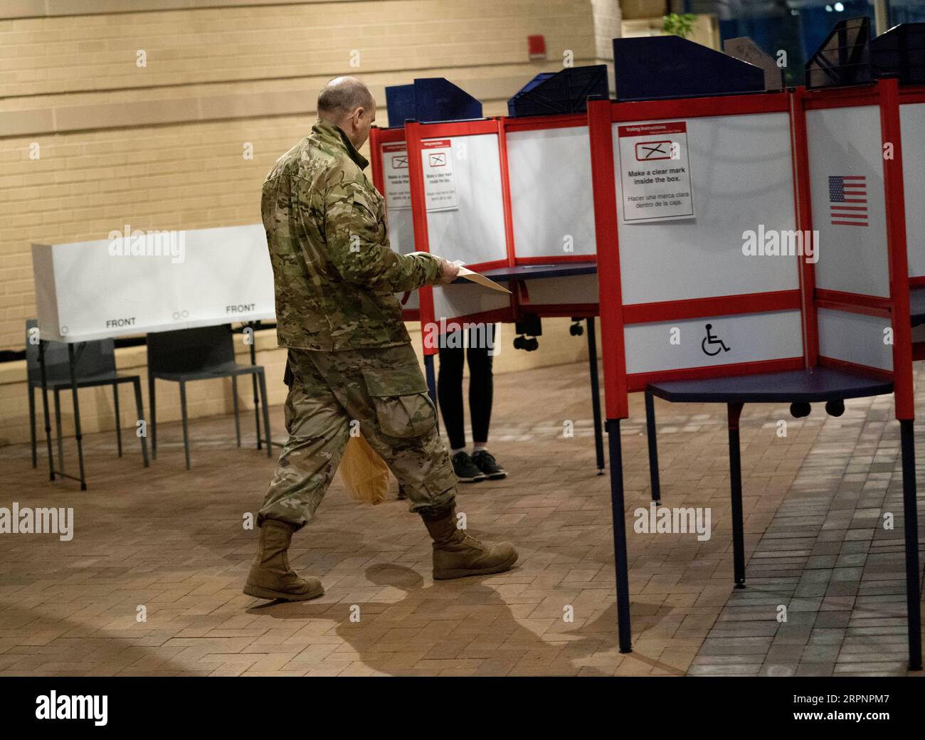 200303 -- ARLINGTON, March 3, 2020 -- A voter walks to fill in his ...