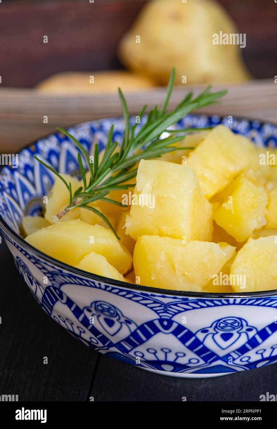 boiled potatoes cut into cubes with rosemary Stock Photo - Alamy