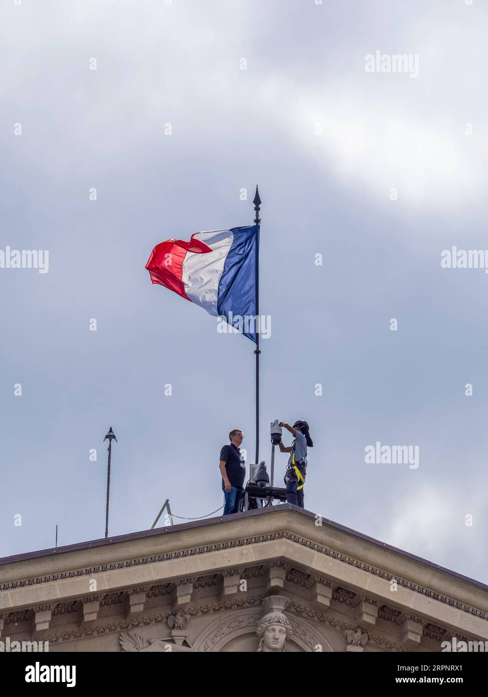 Workers, fixing Security Camera, under the French Flag, French National ...