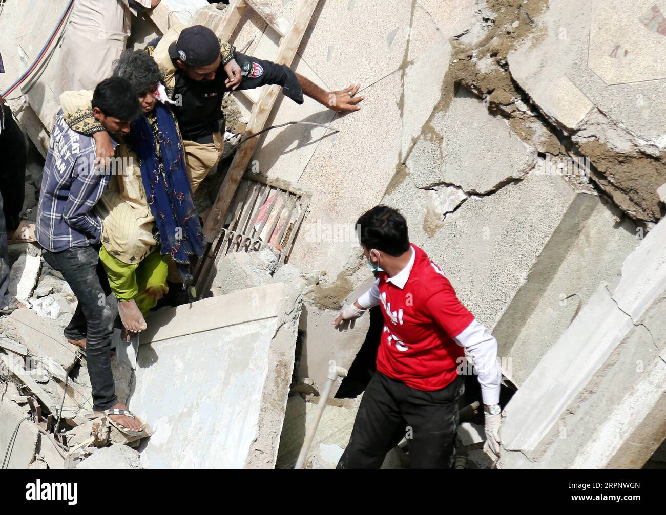 Injured woman building collapse on hi-res stock photography and images ...