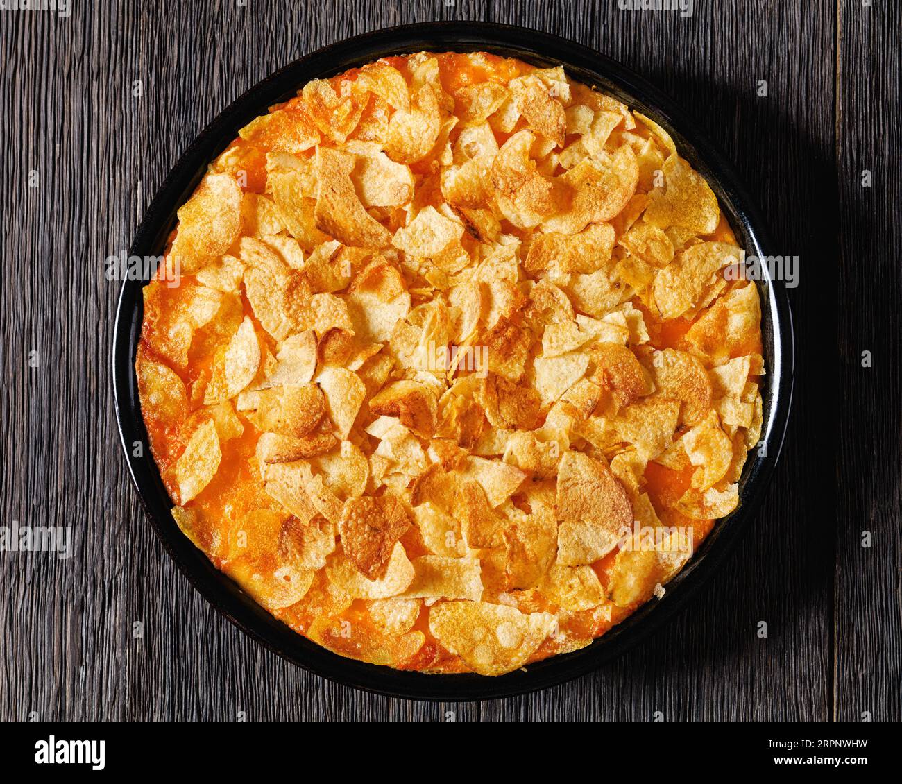creamy cheesy chicken almond casserole topped with potato chips in ...