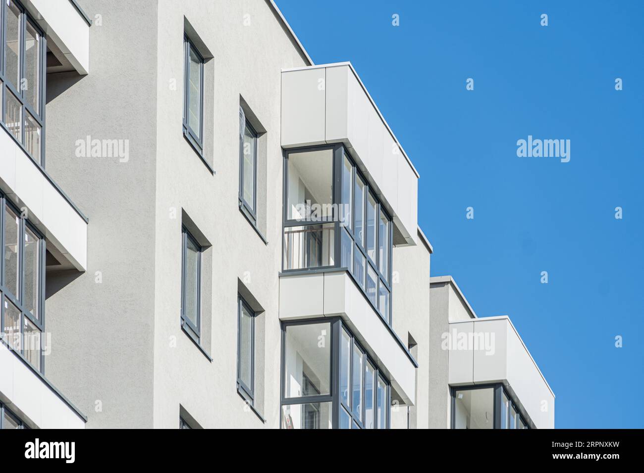 New building facade in housing complex. Modern style in architecture ...