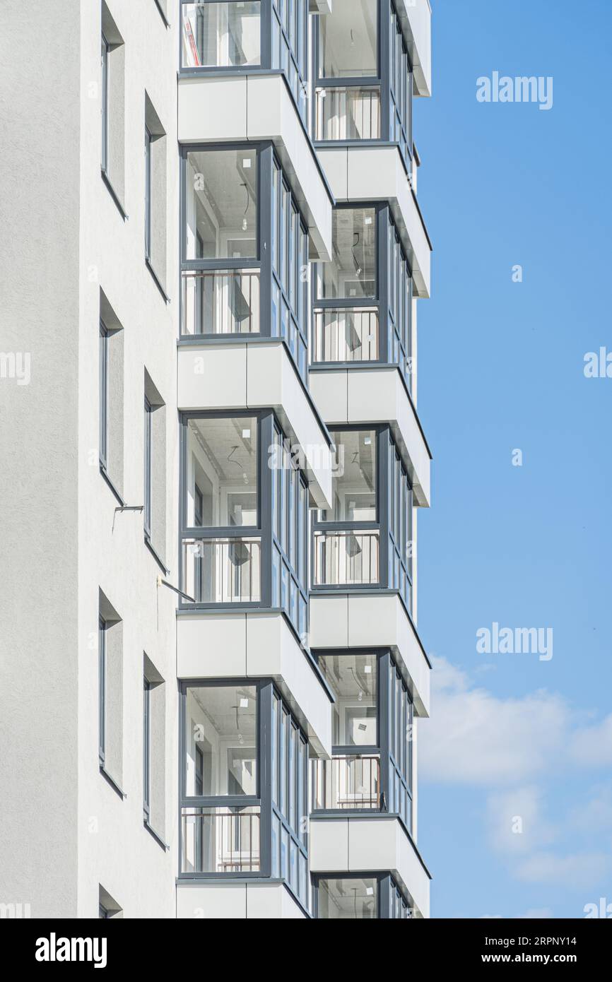 New building facade in housing complex. Modern style in architecture ...