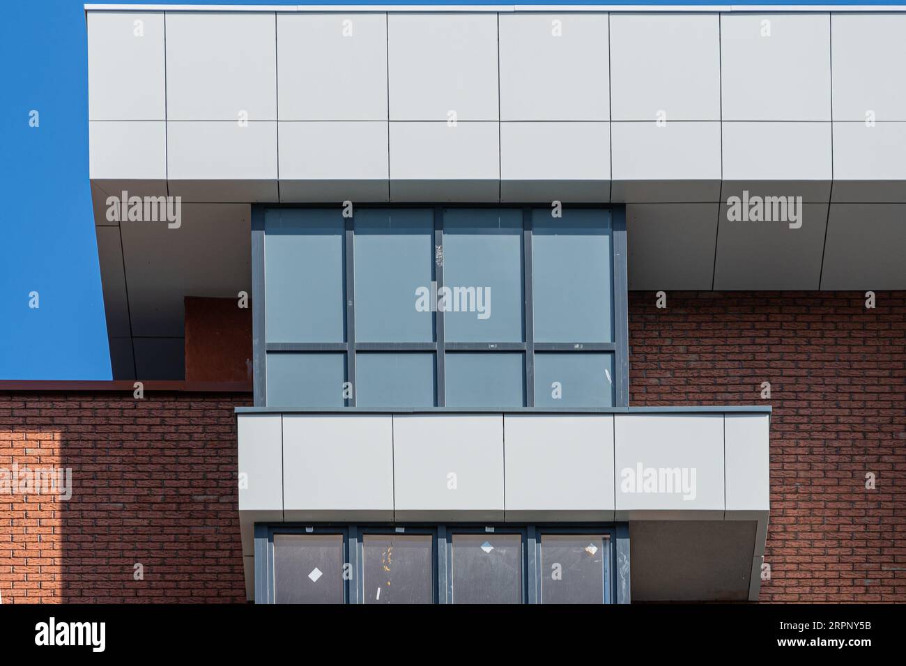 New building facade in housing complex. Modern style in architecture ...