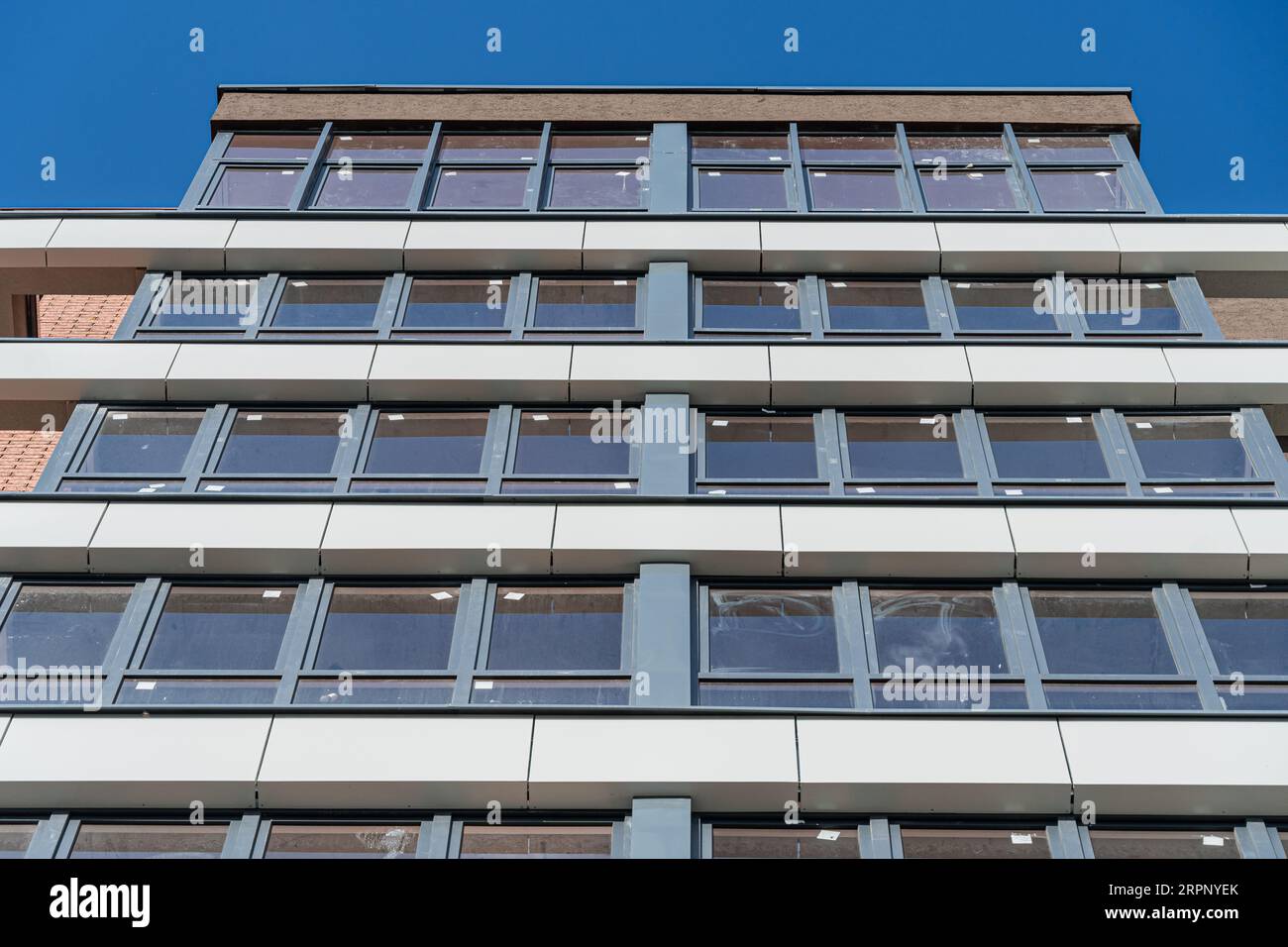 New building facade in housing complex. Modern style in architecture ...