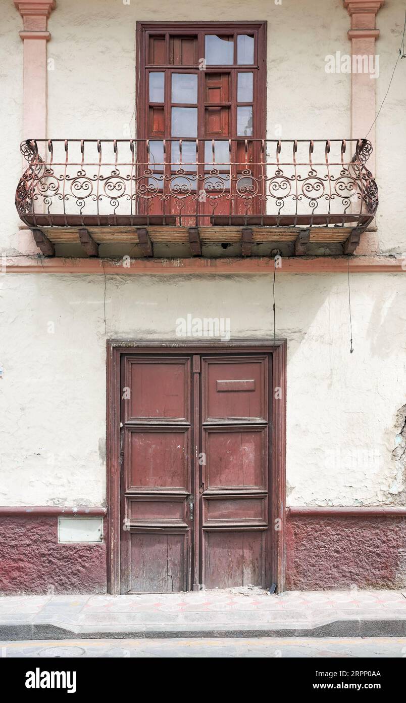 Street view of the old facade of a colonial building, Cuenca, Ecuador ...