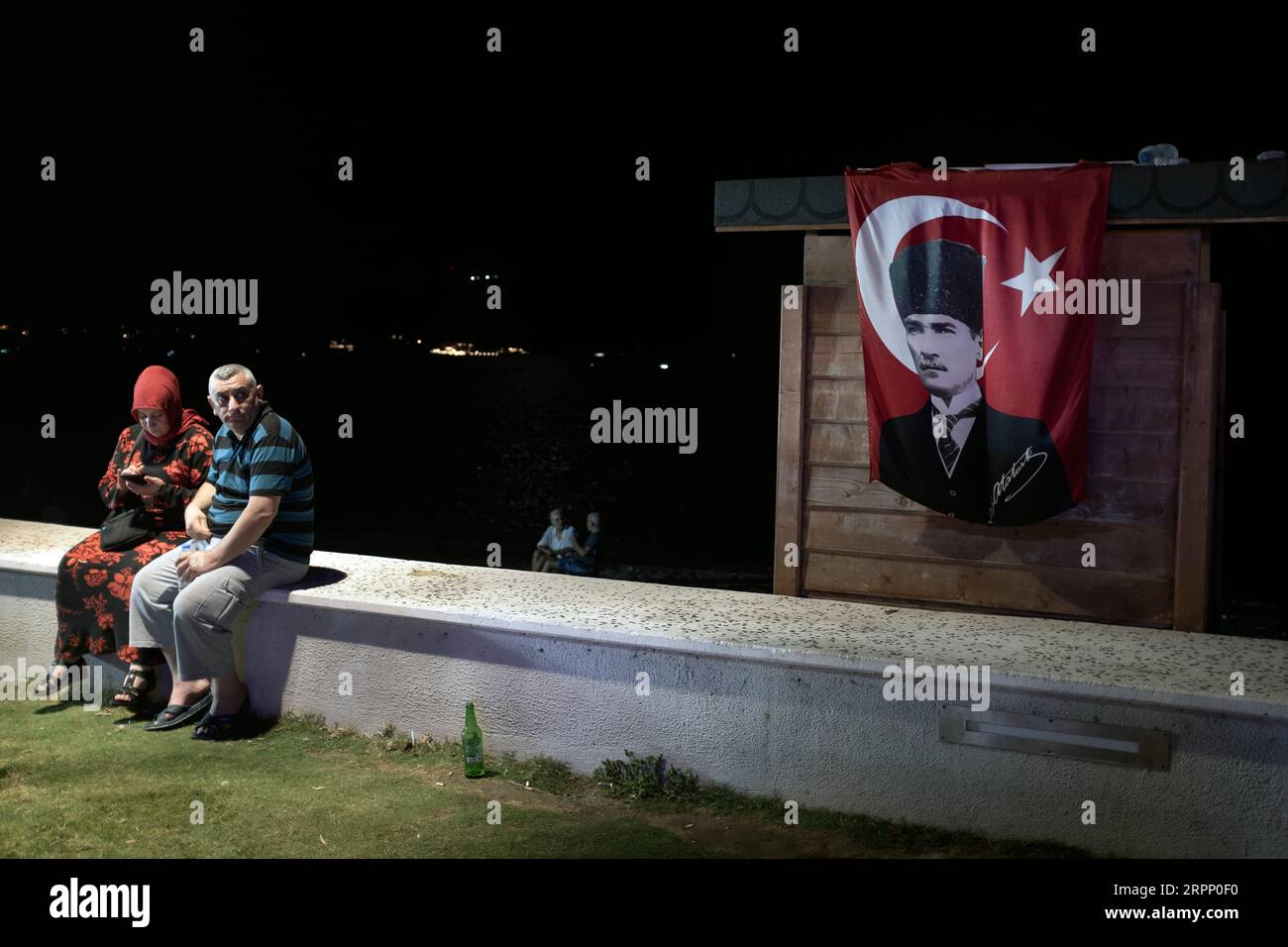 A portrait of Mustafa Kemal Atatürk on a flag hanging ion a building on ...