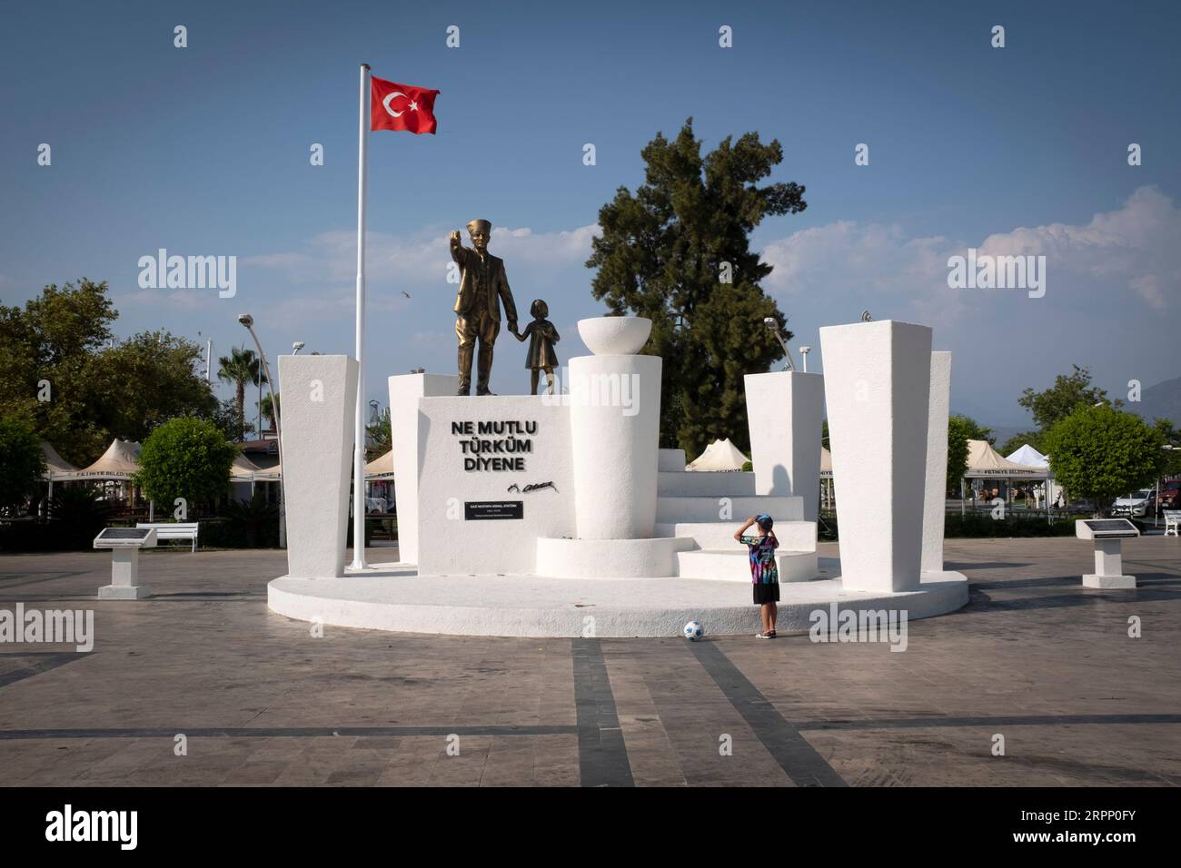 A boy looking at the statue of Mustafa Kemal AtatŸrk in Fethiye, Turkey ...