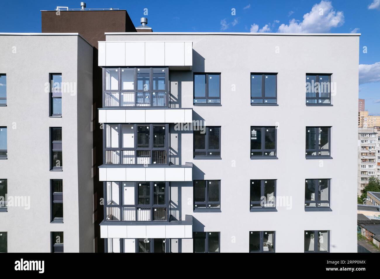 New building facade in housing complex. Modern style in architecture ...