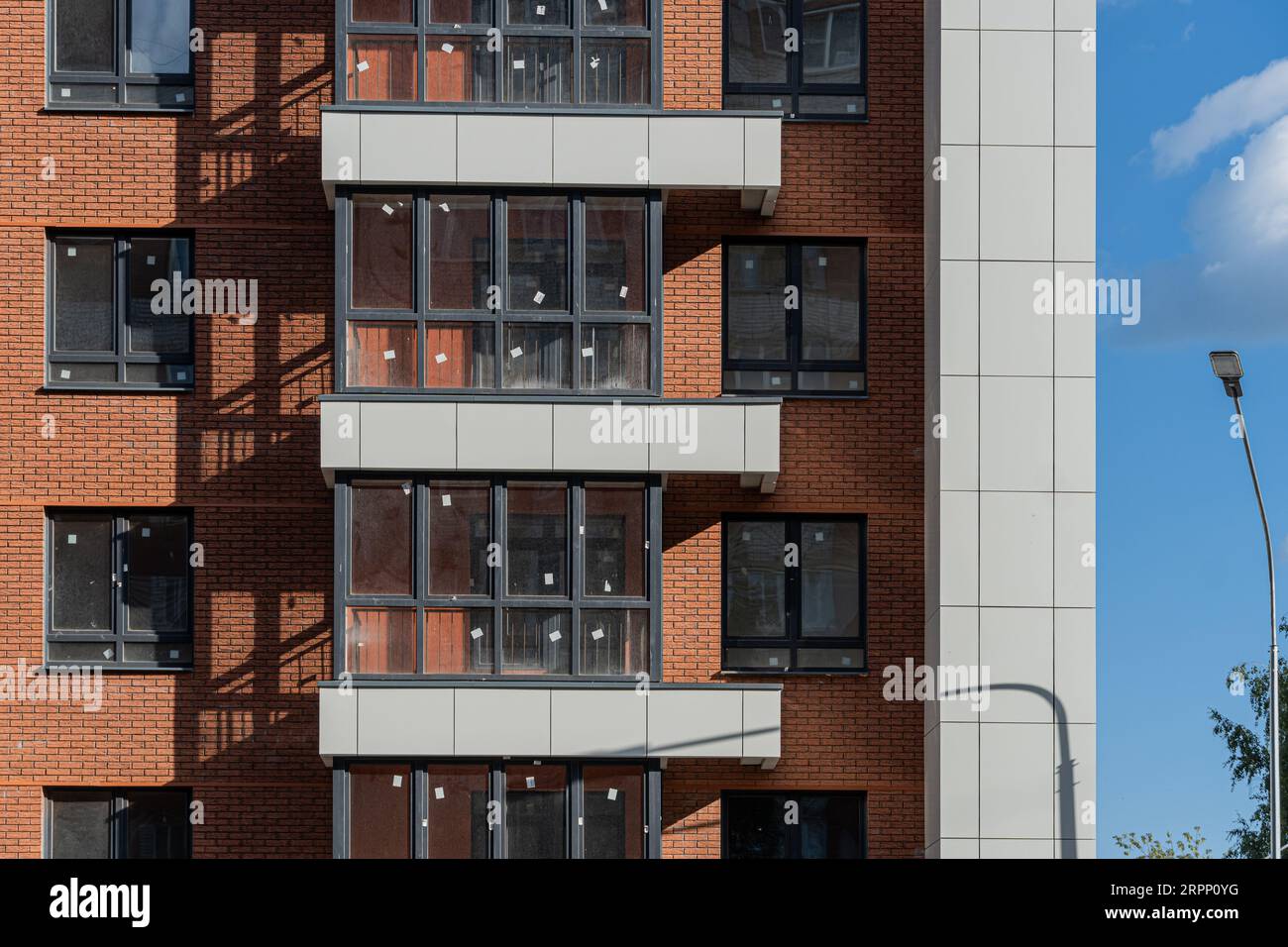 New building facade in housing complex. Modern style in architecture ...