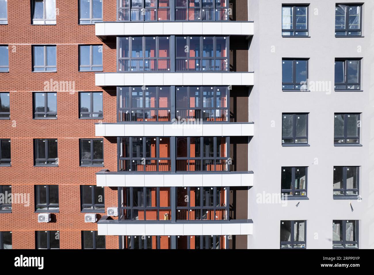 New building facade in housing complex. Modern style in architecture ...