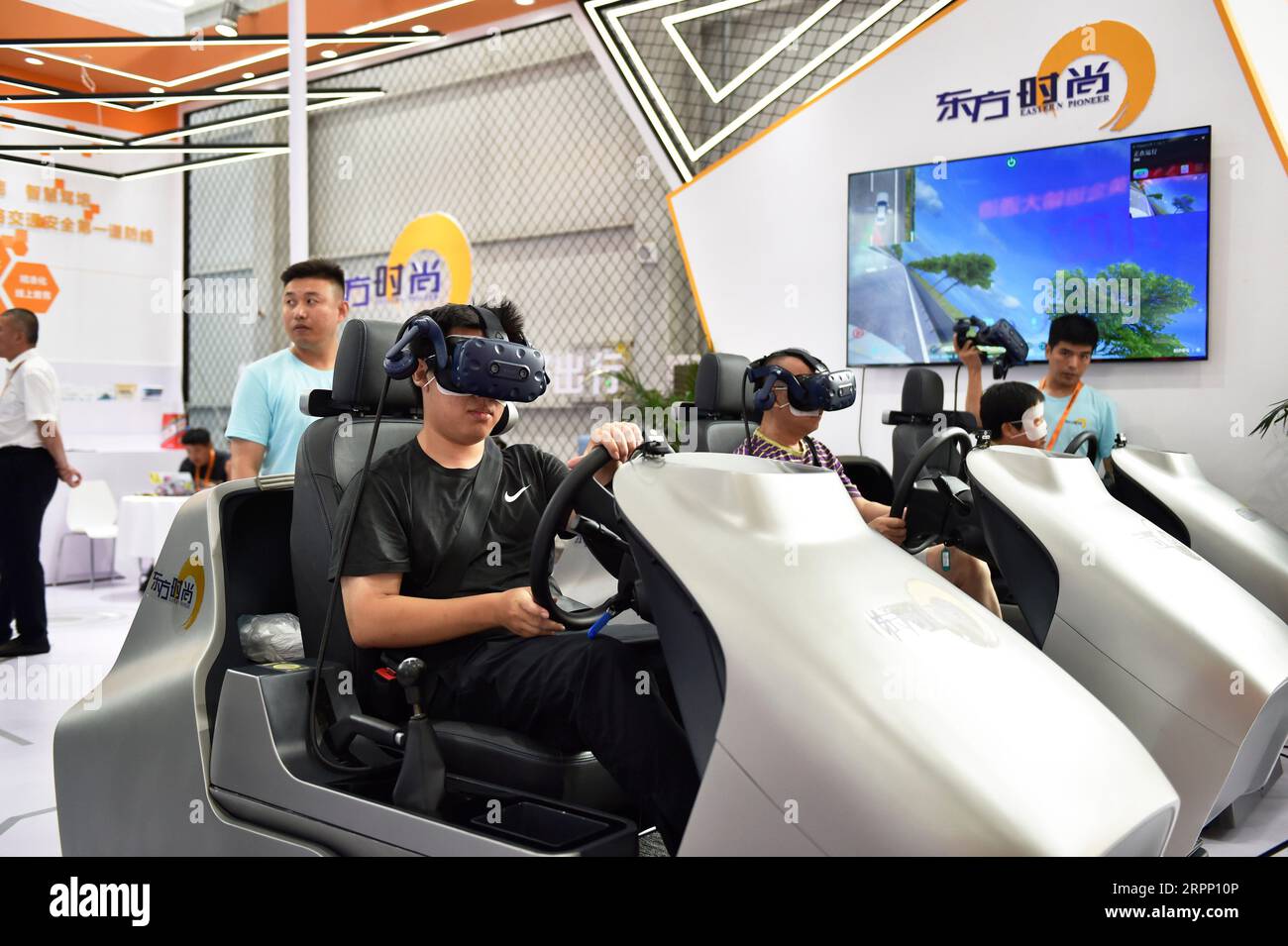 Beijing, China. 5th Sep, 2023. Visitors try VR pilot simulators during ...