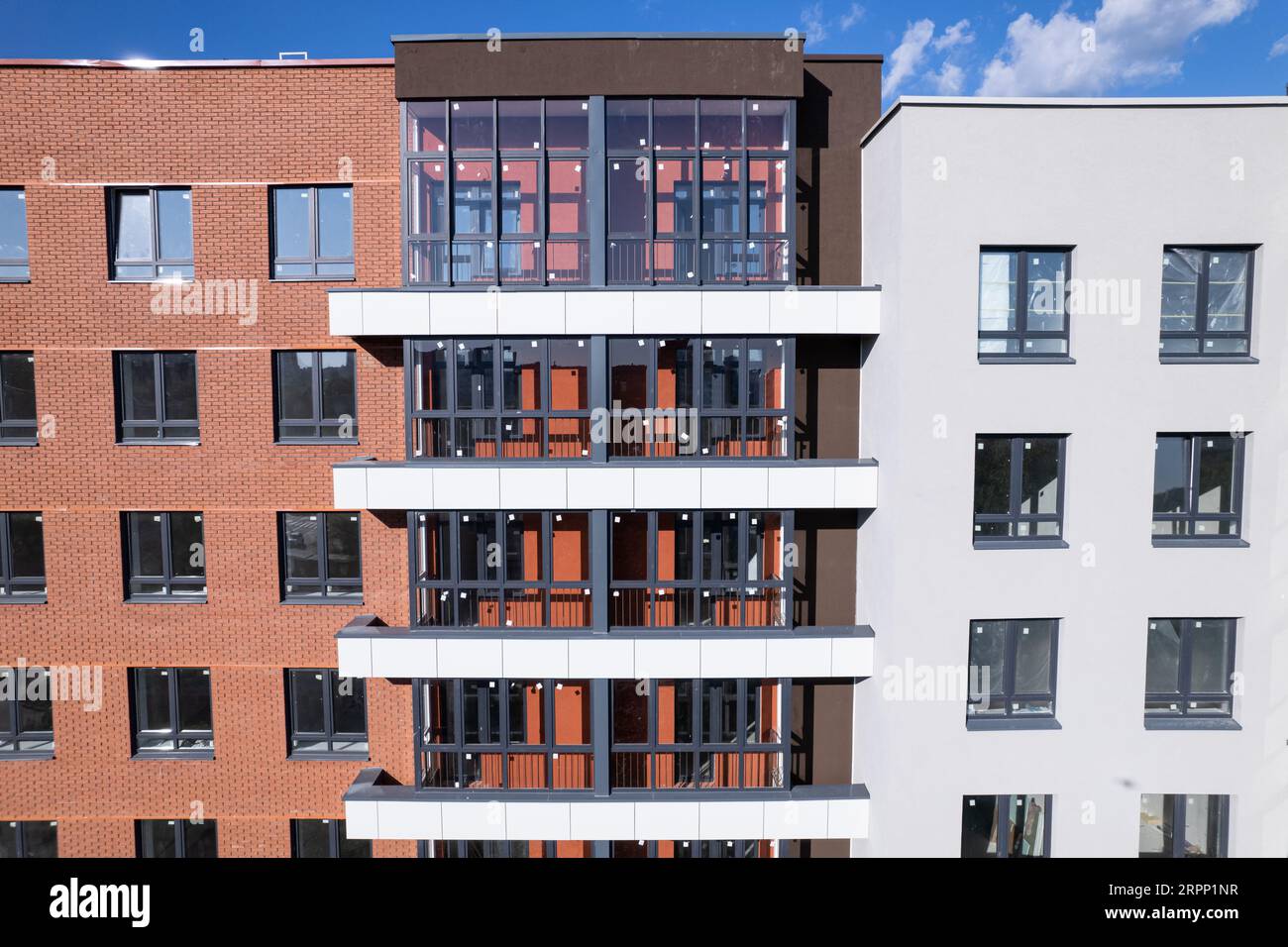 New building facade in housing complex. Modern style in architecture ...