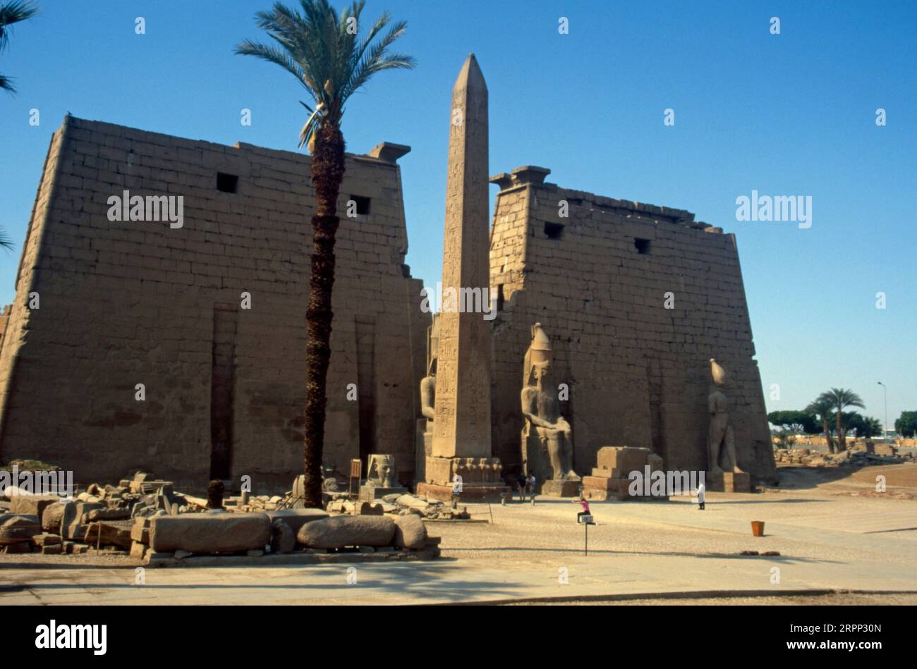 Pylon and statues of Ramesses 2nd at the entrance to Luxor Temple Luxor ...