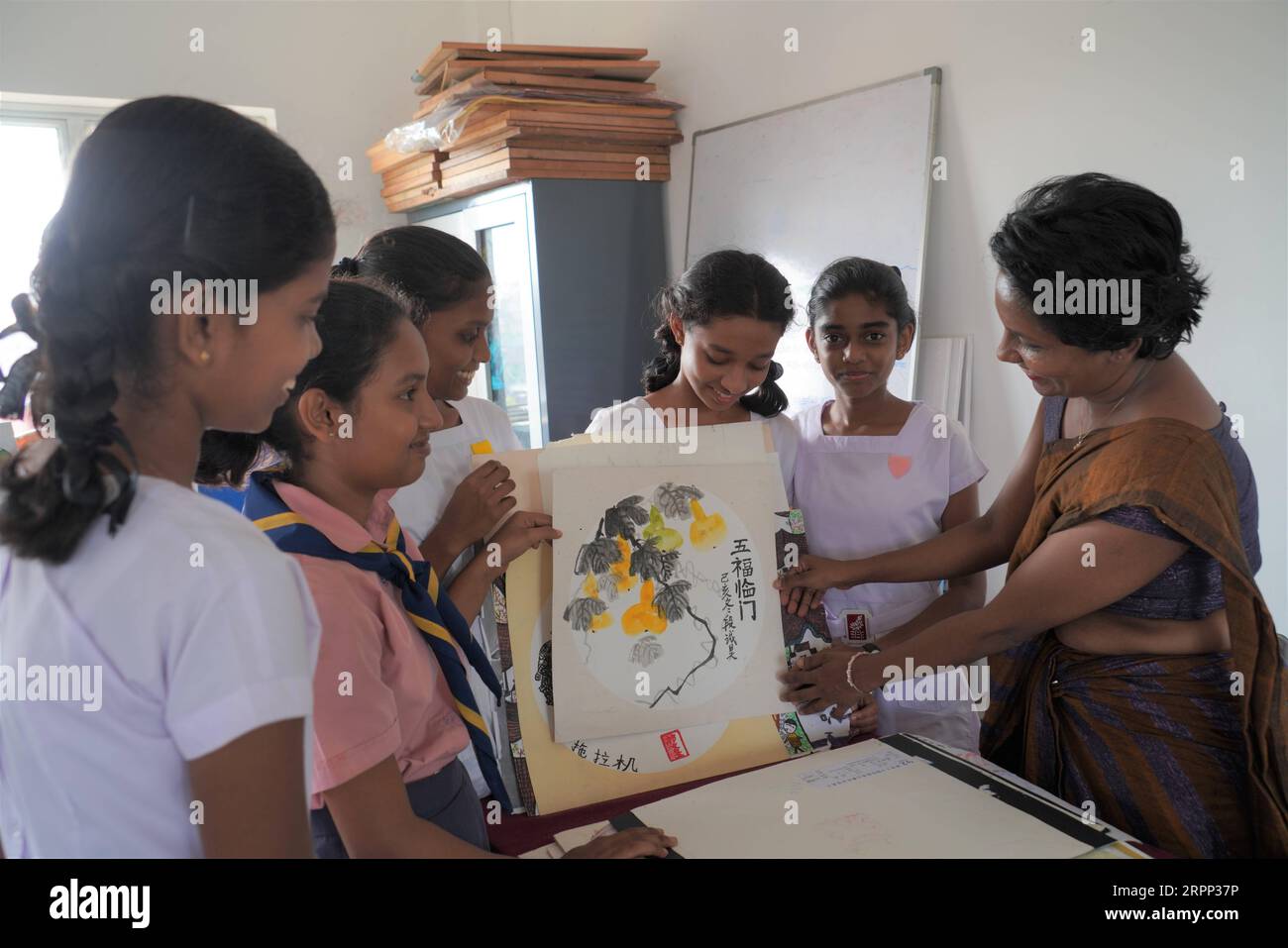 200309 -- COLOMBO, March 9, 2020 -- A teacher and students in Devi ...