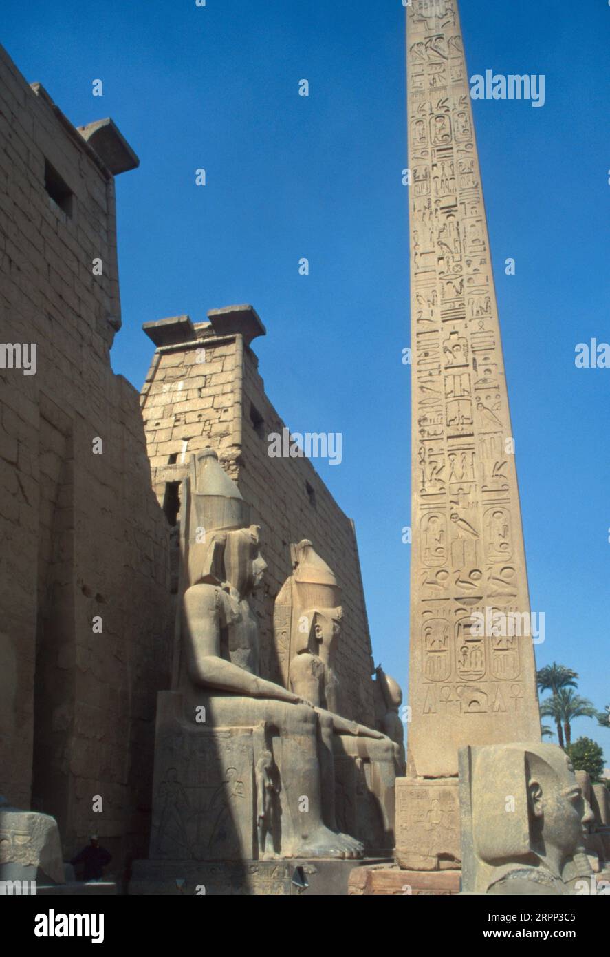 Pylon and statues of Ramesses 2nd at the entrance to Luxor Temple Luxor ...