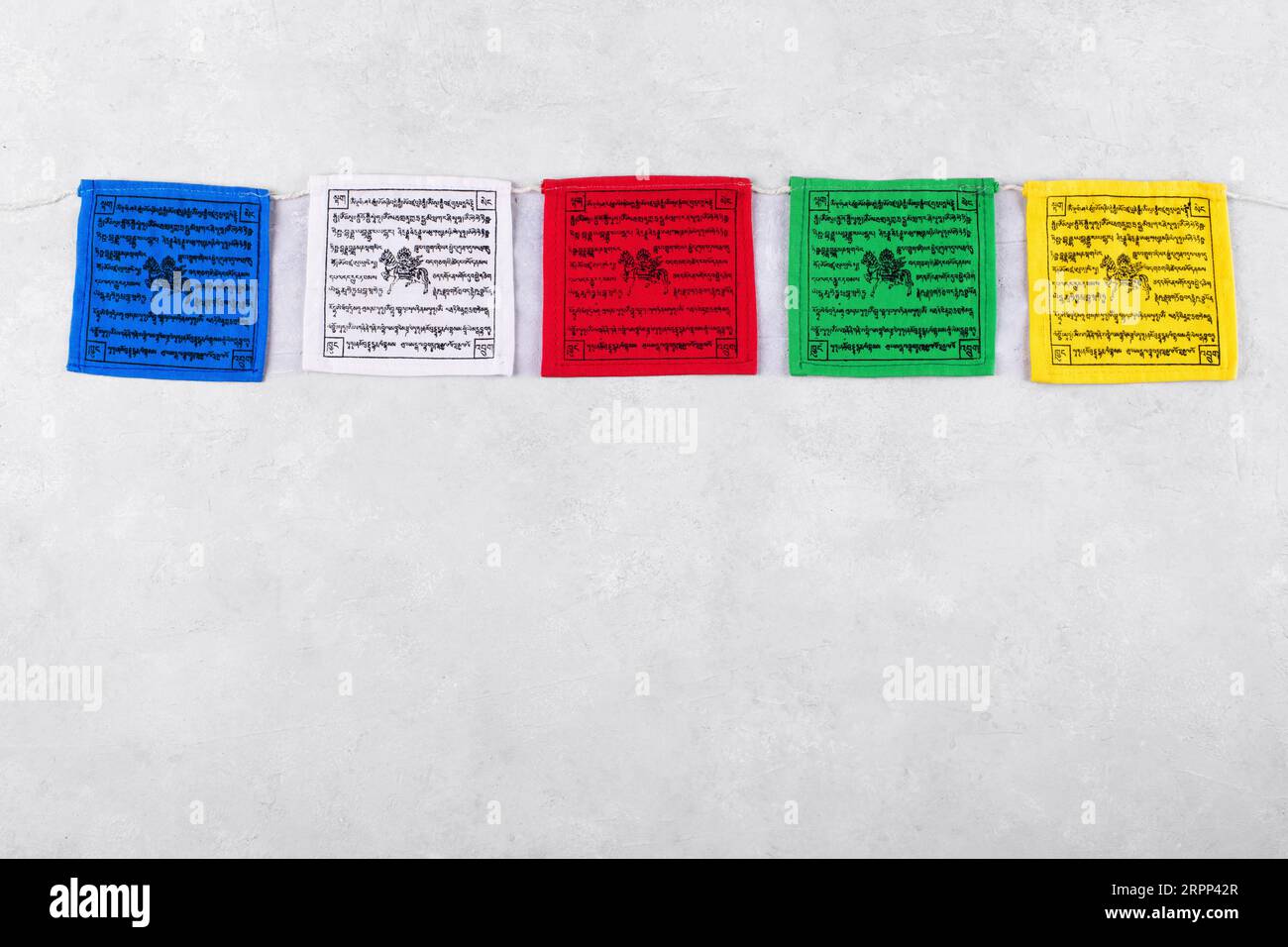 Colorful Tibetan buddhist prayer flags by Nepal on a grey background ...