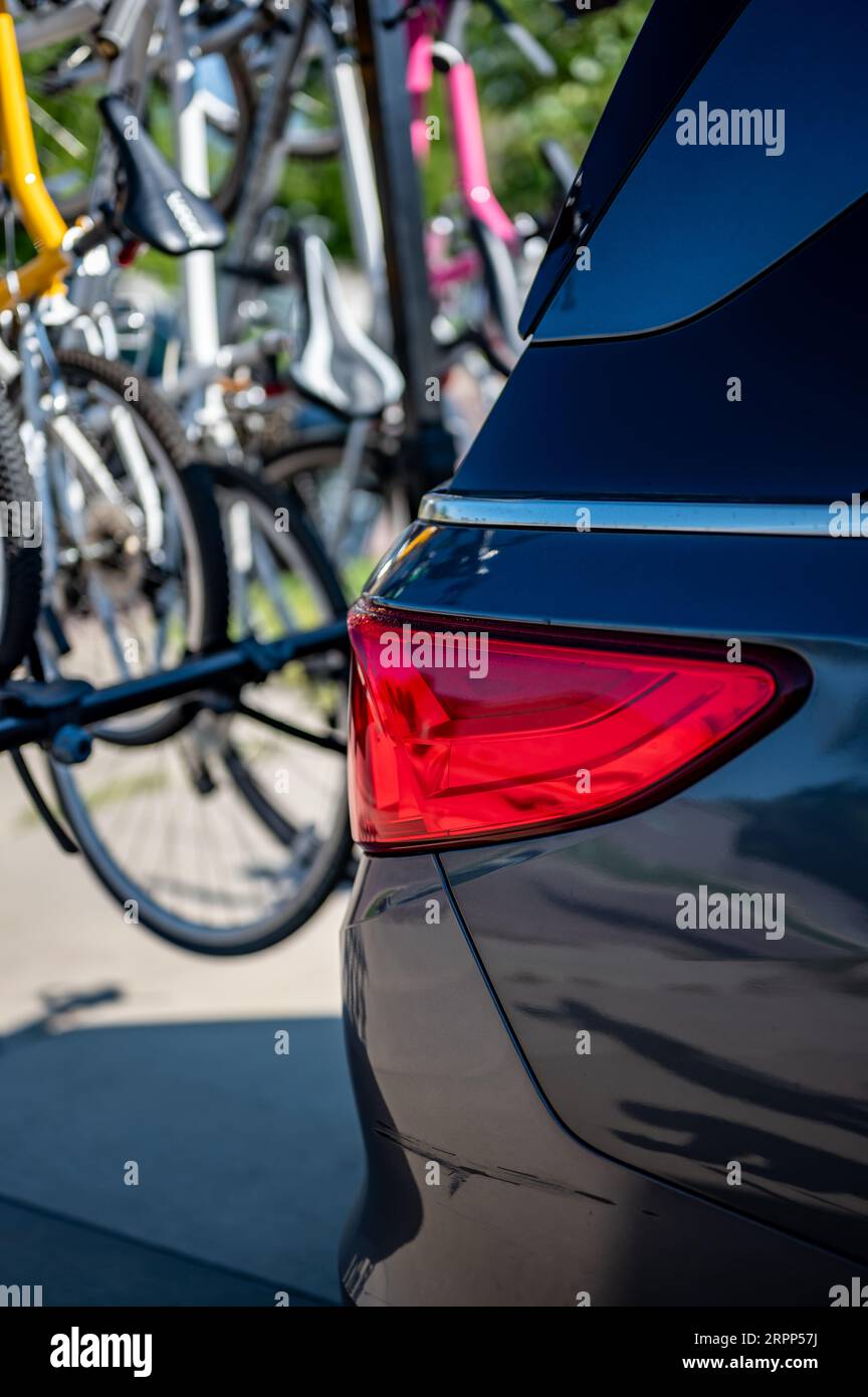 vertical mounted bikes on a vehicle carrier attached to a trailer hitch ...