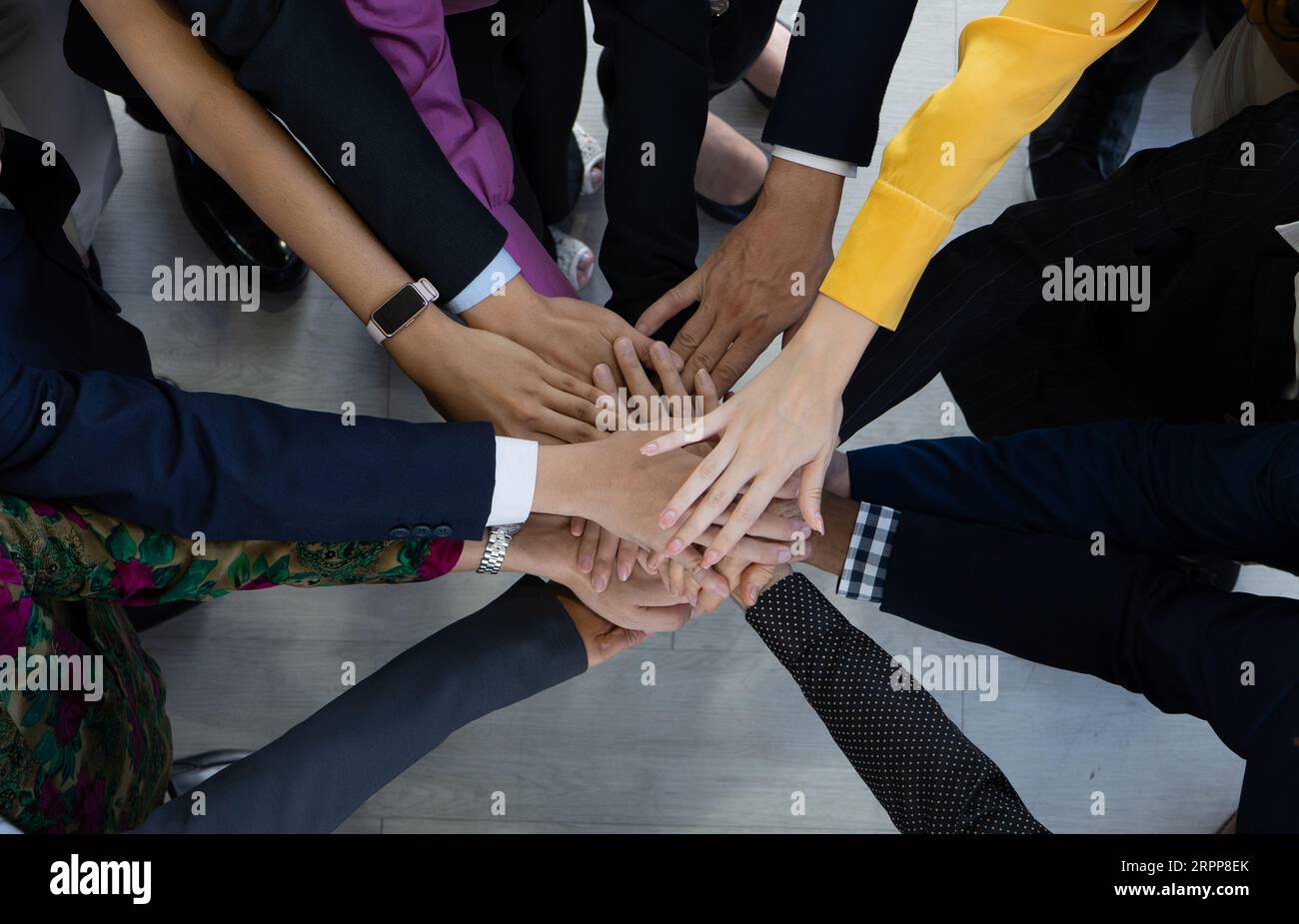 Team, teamwork, and unity concept. Diverse team putting hands together ...