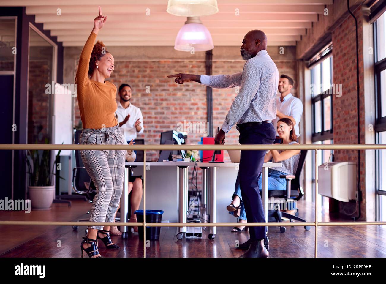 Relaxed Business Team Meeting In Busy Multi-Cultural Office With ...