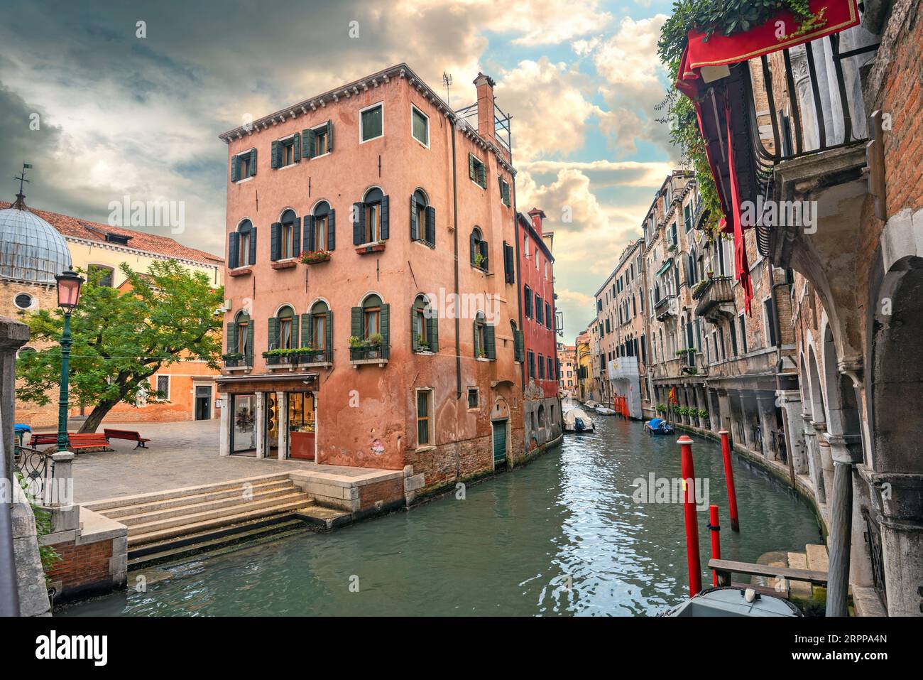 Cityscape with historical buildings and little square on water canal in ...