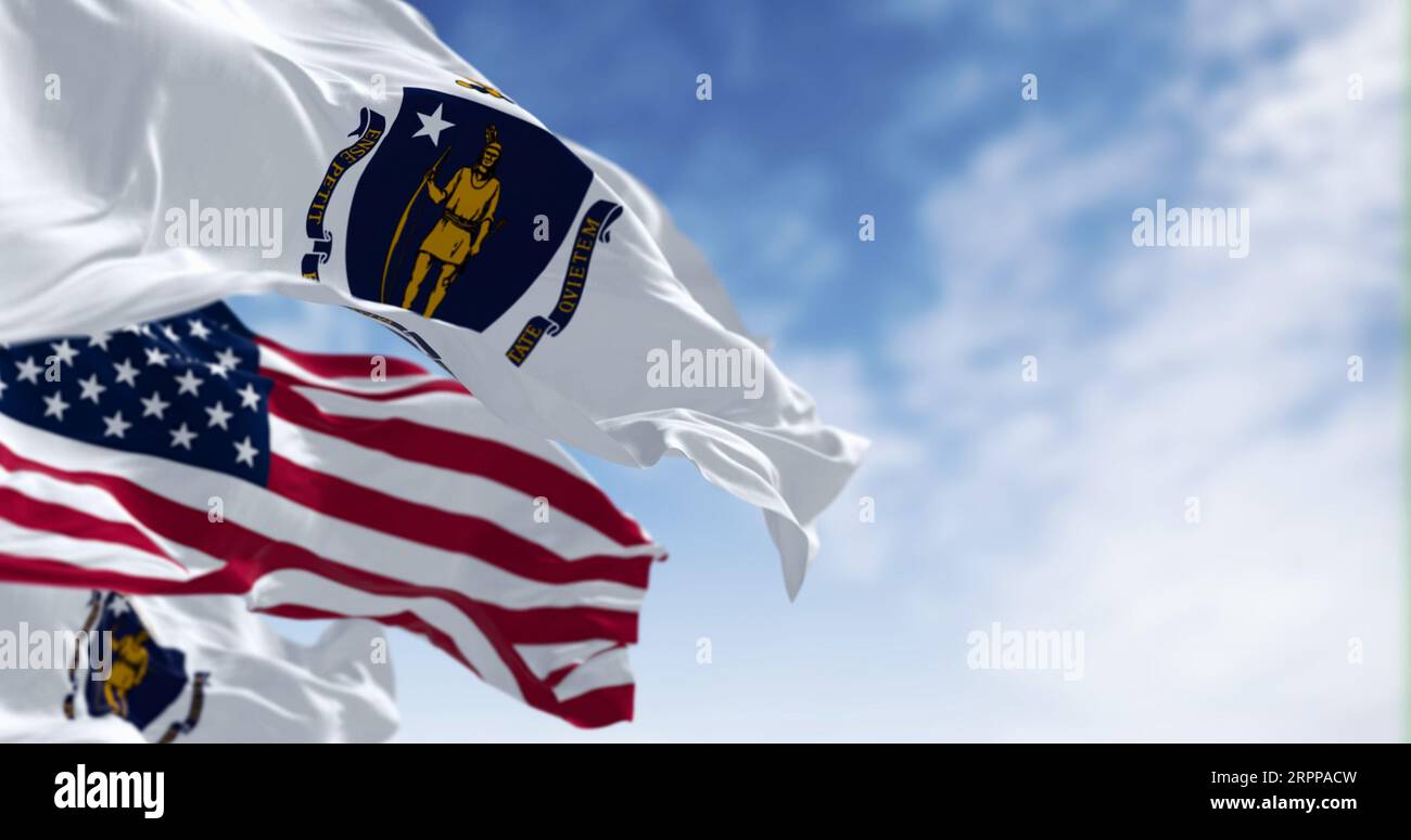 The flags of Massachusetts and the United States waving in the wind on ...