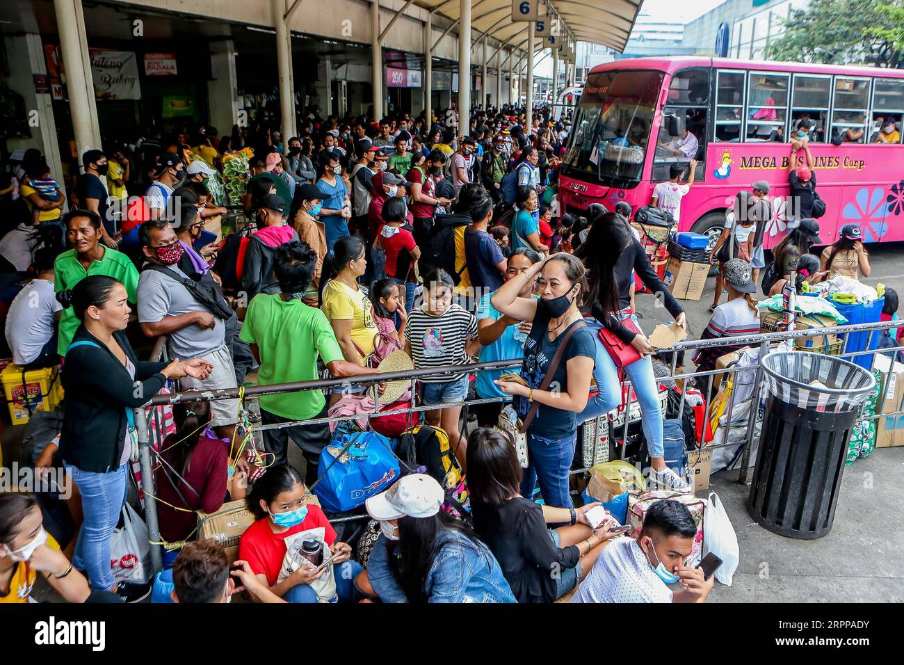200314 -- QUEZON CITY, March 14, 2020 -- People are seen at a bus ...