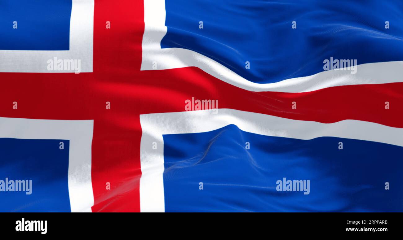Close-up of Iceland national flag waving. Blue with a white cross and a ...