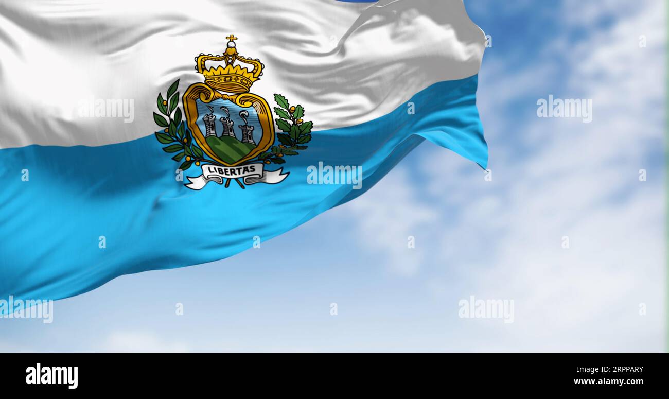 National flag of San Marino waving in the wind on a clear day. Republic ...