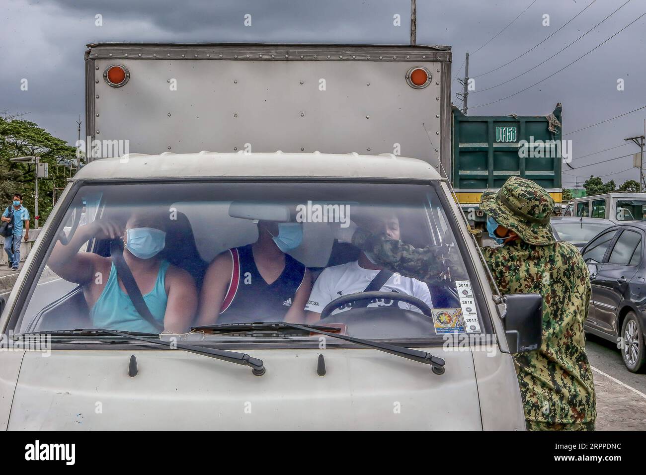 200316 -- QUEZON CITY, March 16, 2020 -- A policeman from the ...
