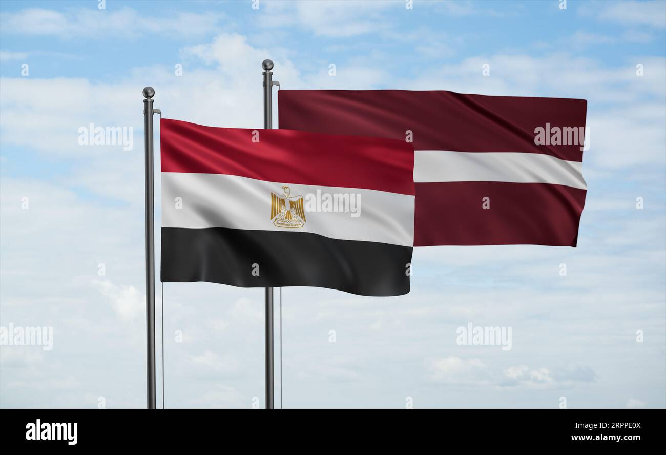 Latvia and Egypt flag waving together in the wind on blue sky, two ...