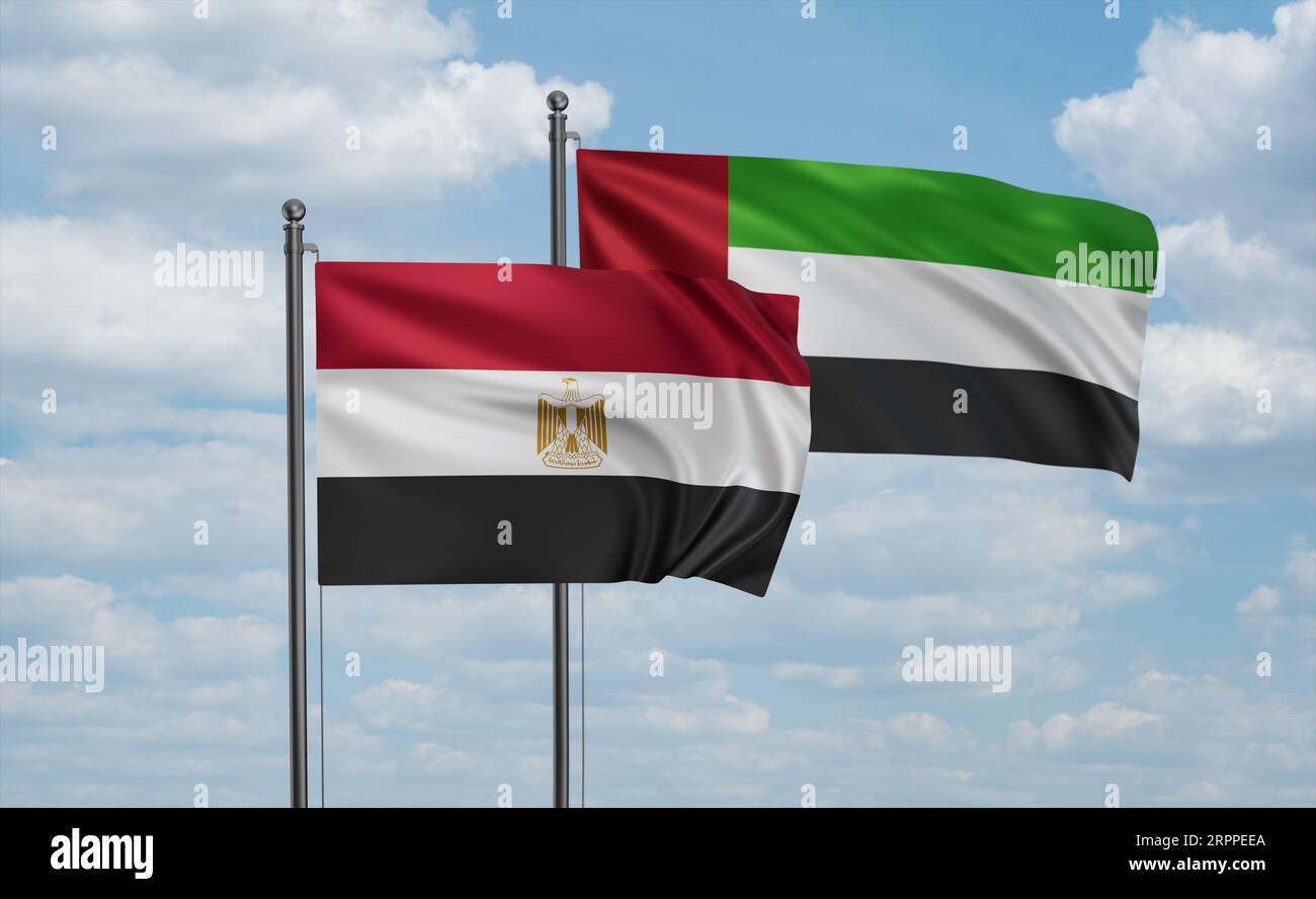 United Arab Emirates and Egypt flag waving together in the wind on blue ...