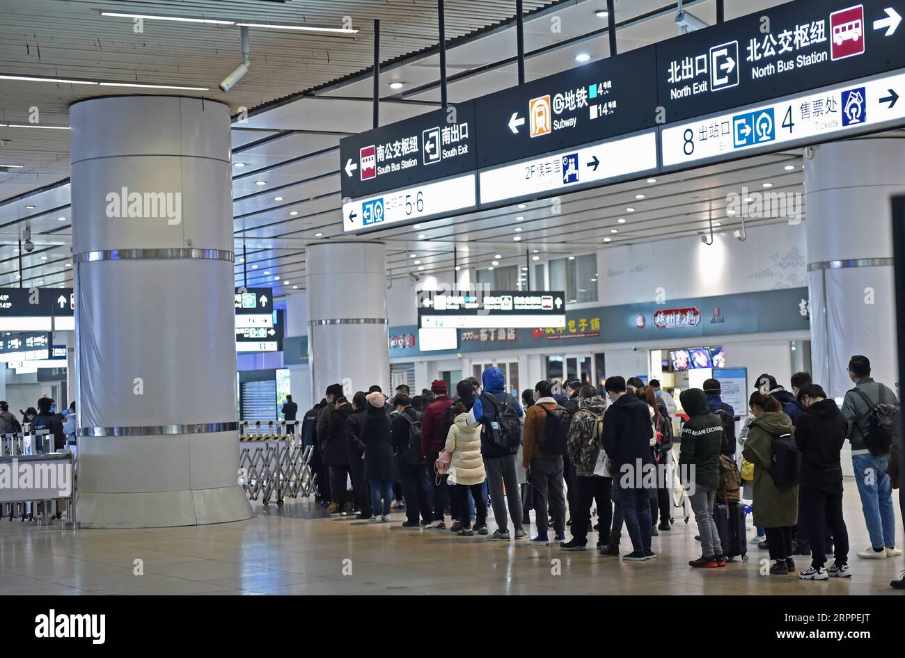 200316 -- BEIJING, March 16, 2020 -- Passengers line up to enter a ...