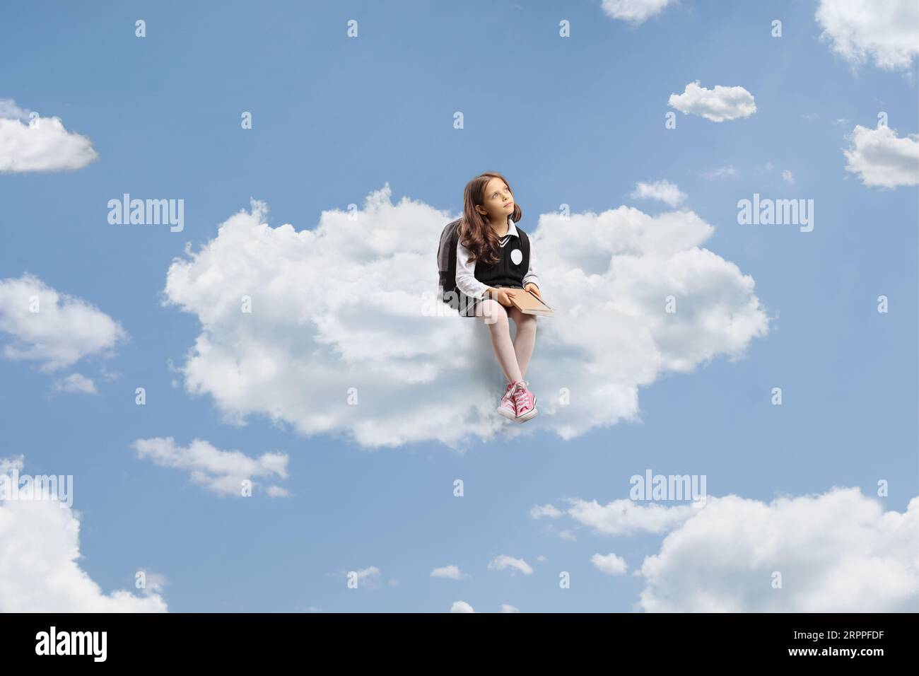 Little girl sitting on cloud hi-res stock photography and images - Alamy