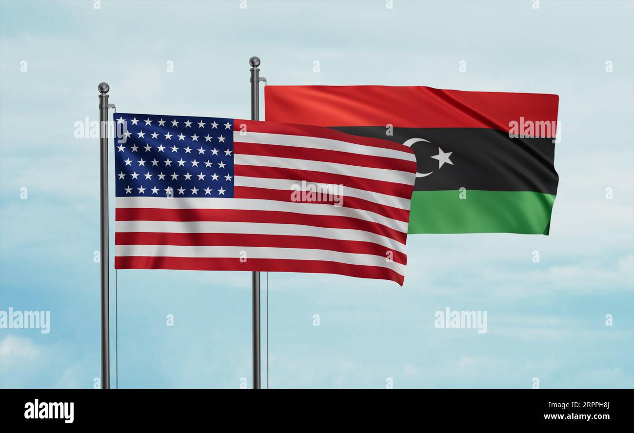 Libya and USA flag waving together in the wind on blue sky, two country ...
