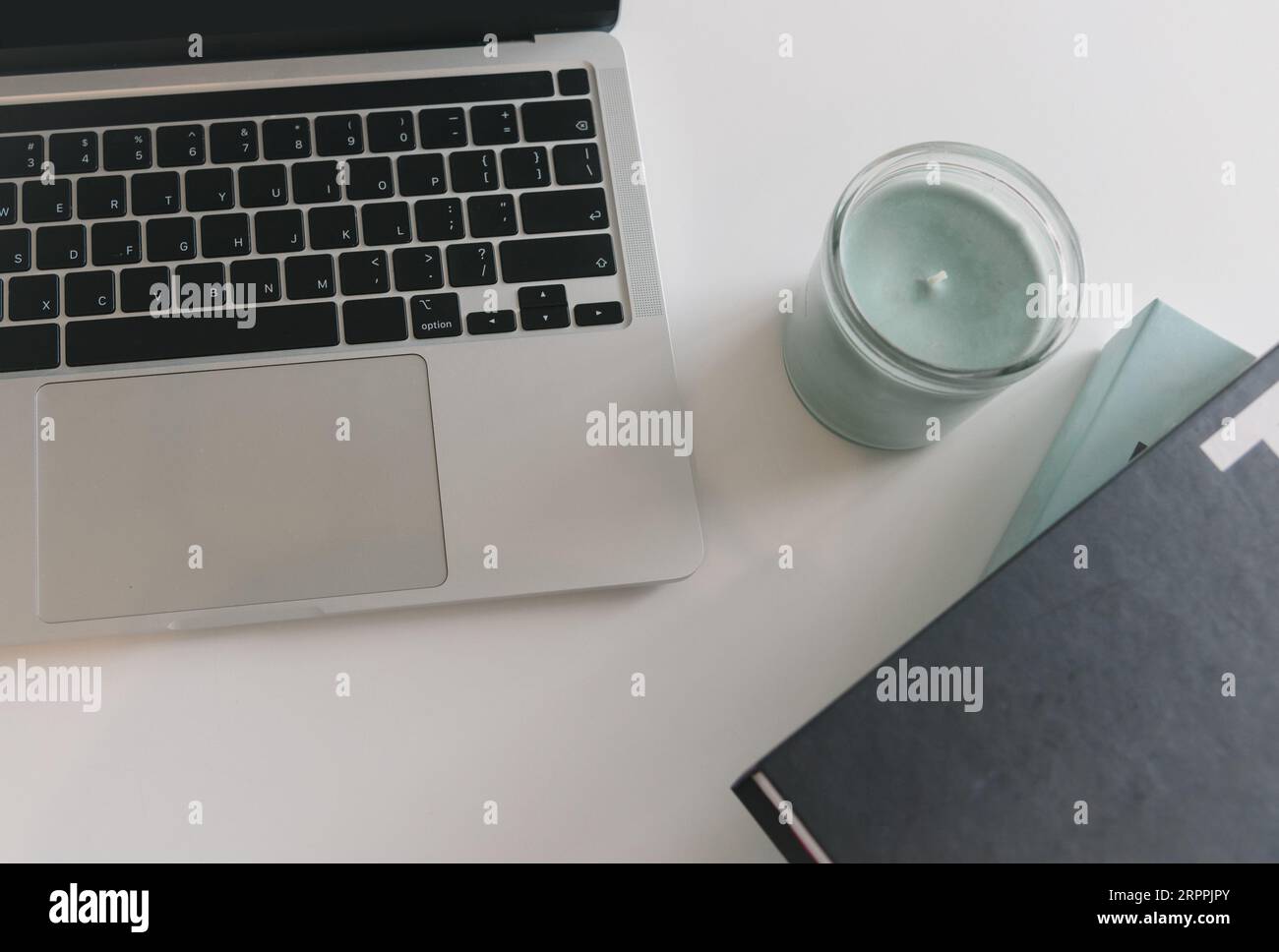 Top view laptop computer and book on white background. Flat lay with ...