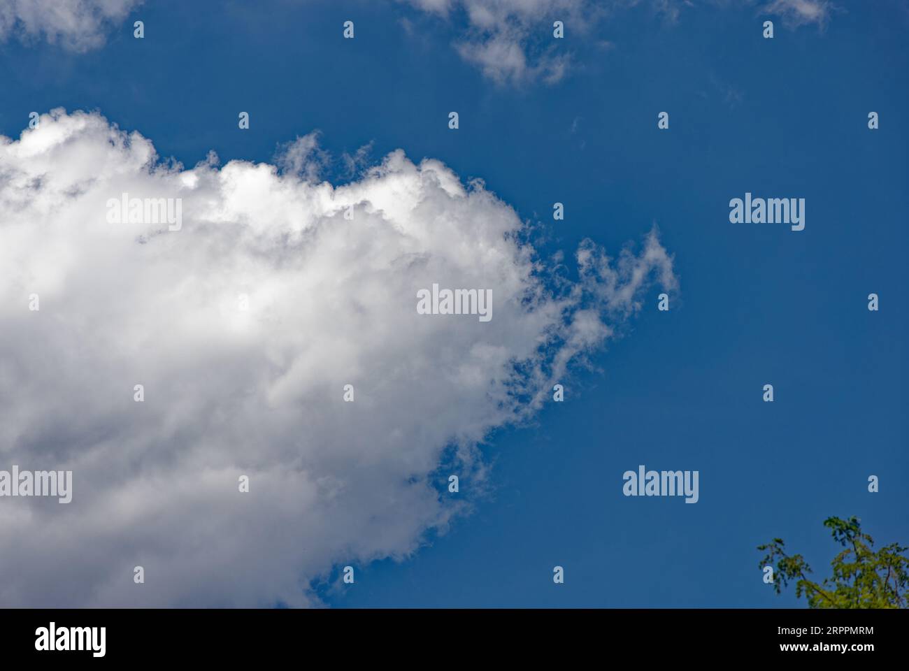 Billowing white clouds gliding over hi-res stock photography and images ...