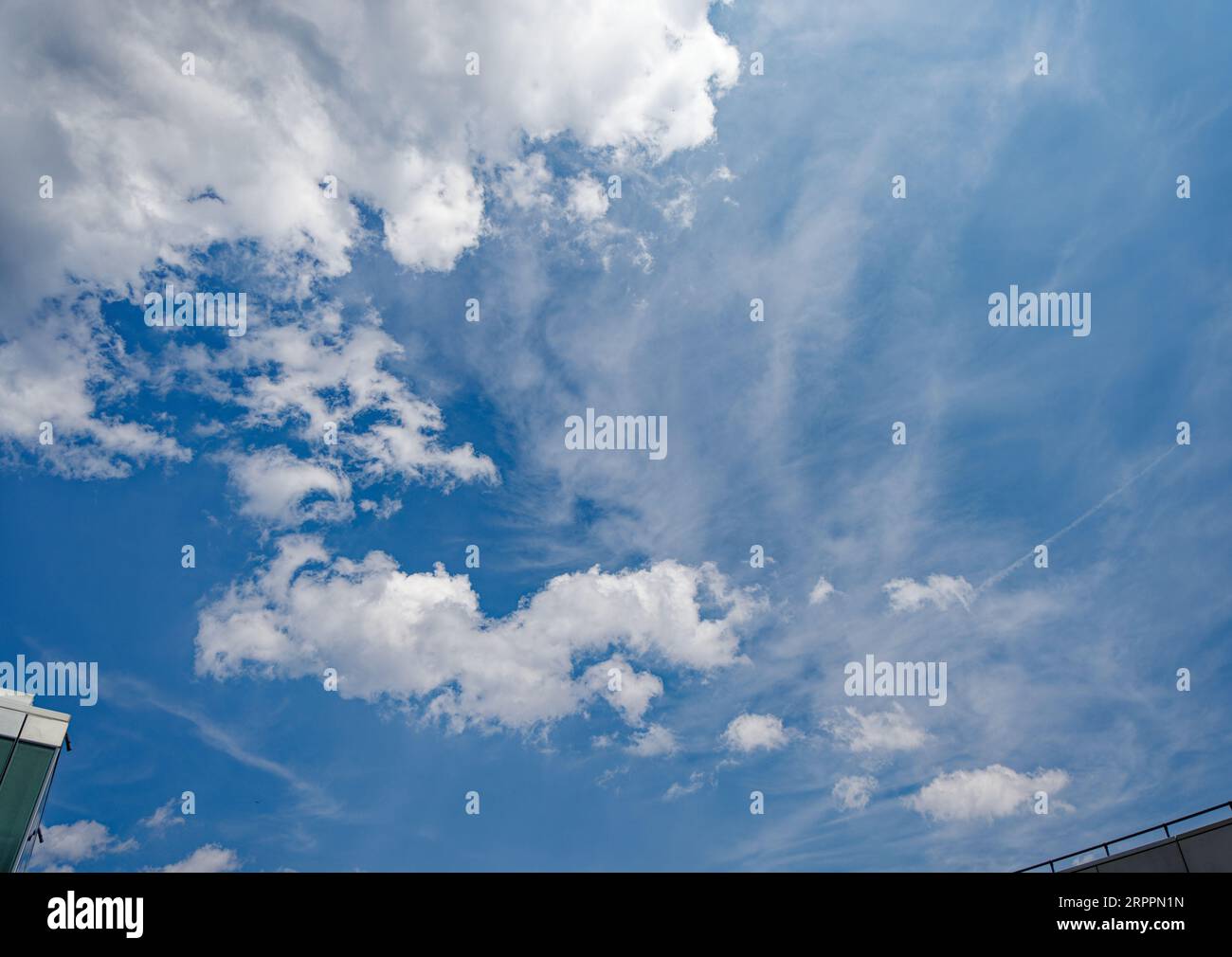 White clouds, blue summer sky over New York Harbor (Upper Bay); mix of ...