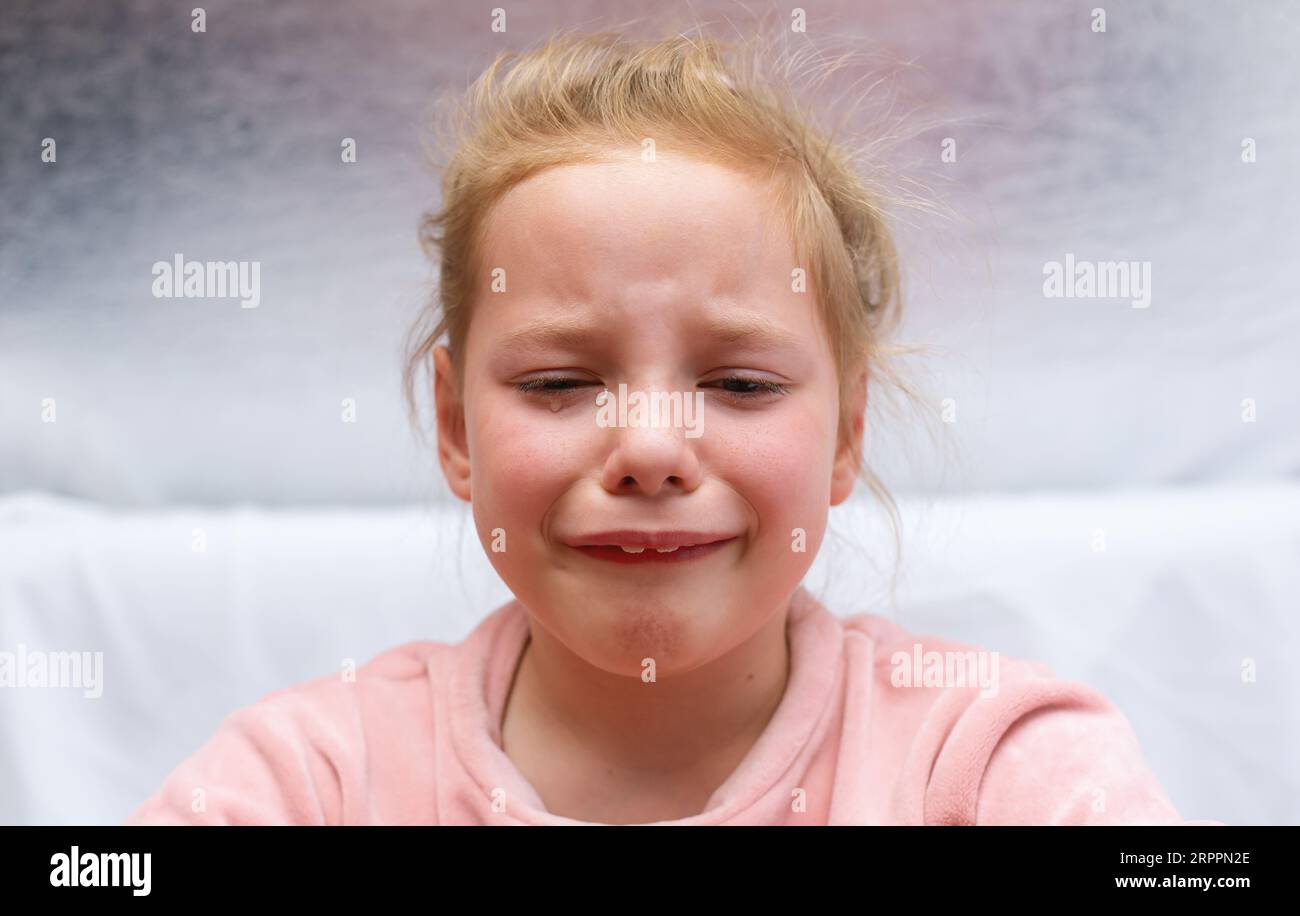 Dramatic photo of a crying kid Stock Photo - Alamy