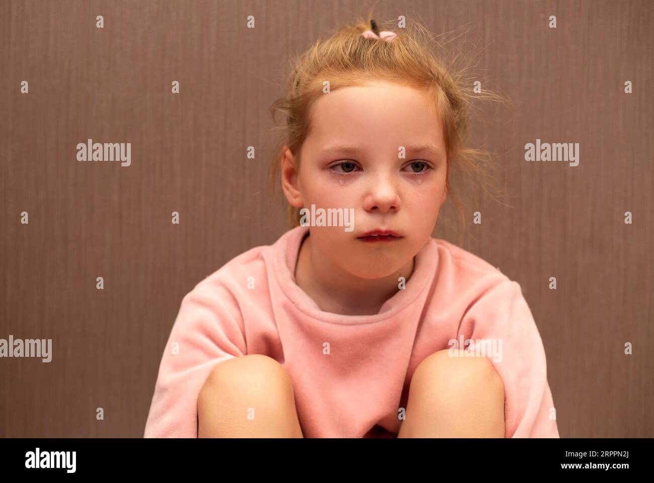 Dramatic photo of a crying kid Stock Photo - Alamy