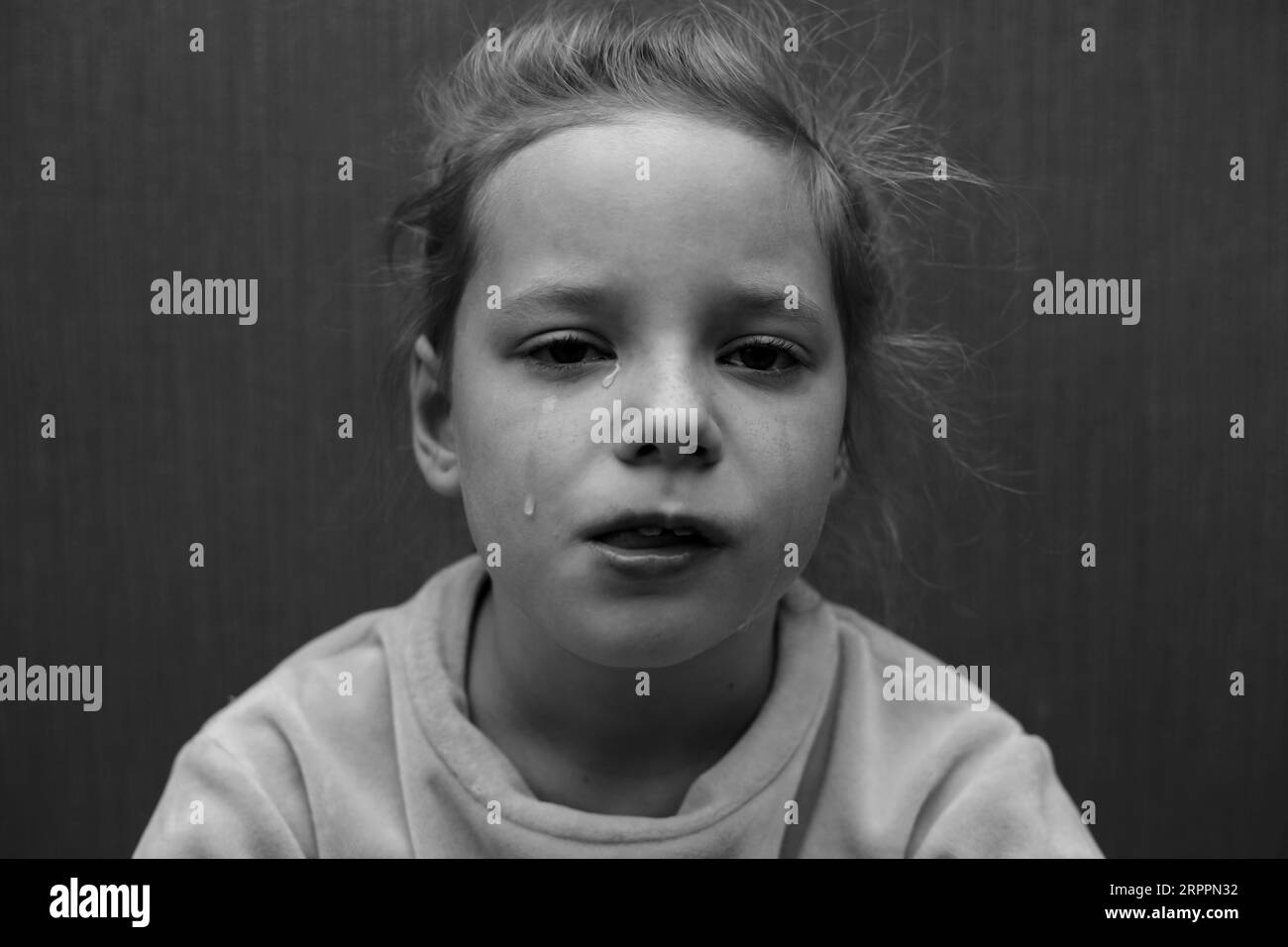 Dramatic photo of a crying kid Stock Photo - Alamy
