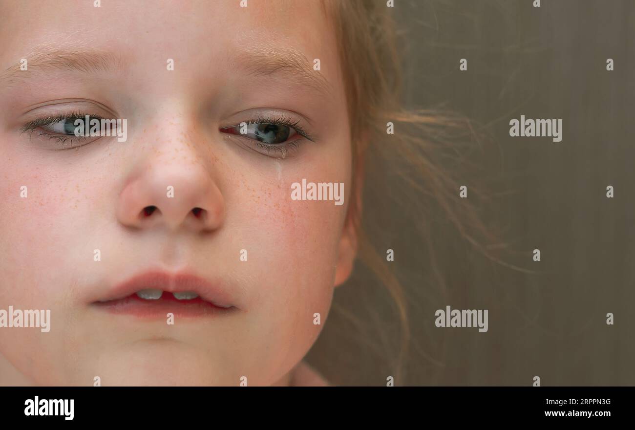 Dramatic photo of a crying kid Stock Photo - Alamy