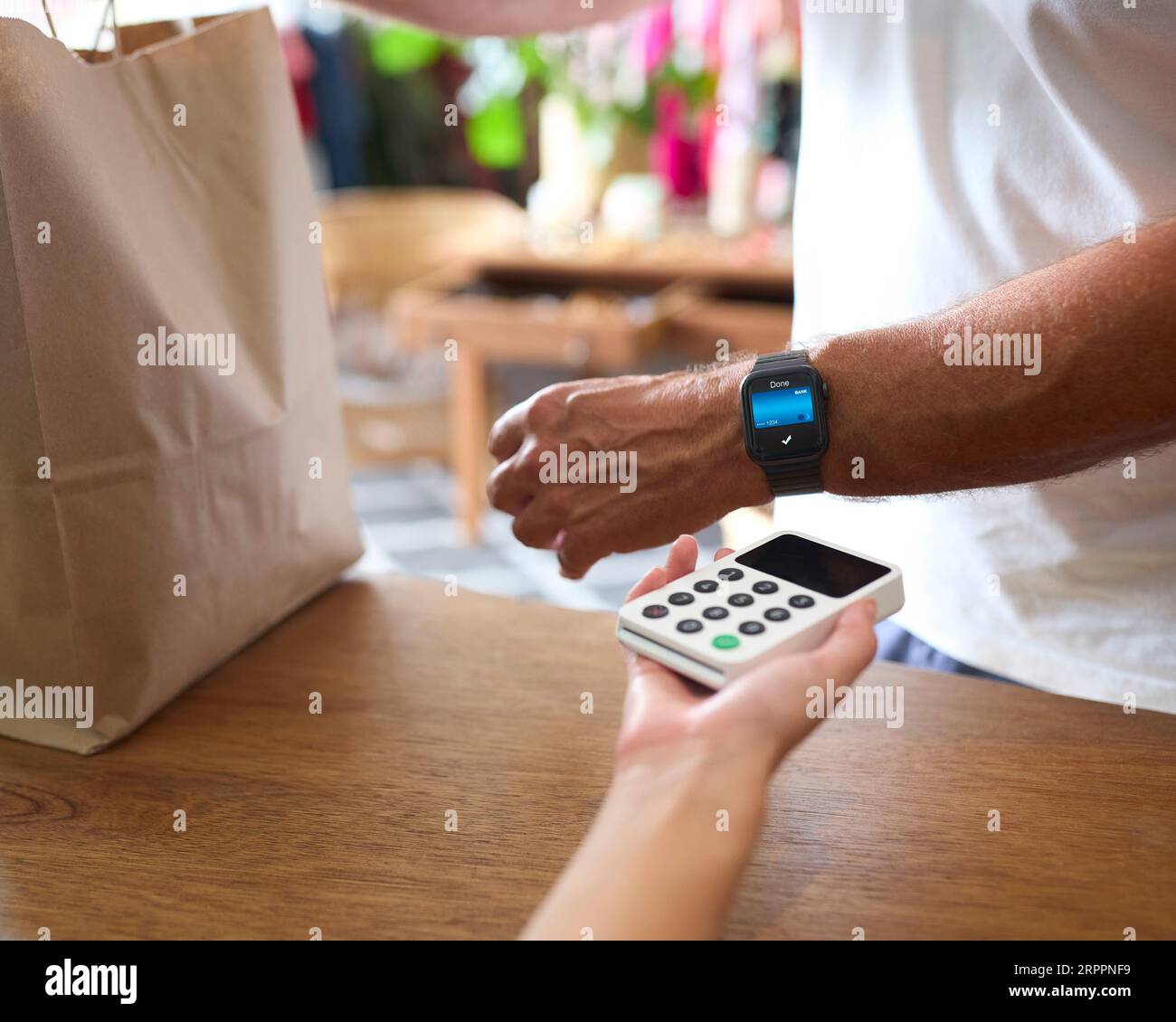 Smart watch store paying hi-res stock photography and images - Alamy